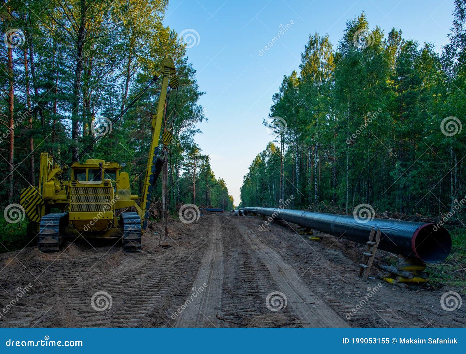 Excavator Clearing Forest for New Development. Orange Backhoe Modified ...