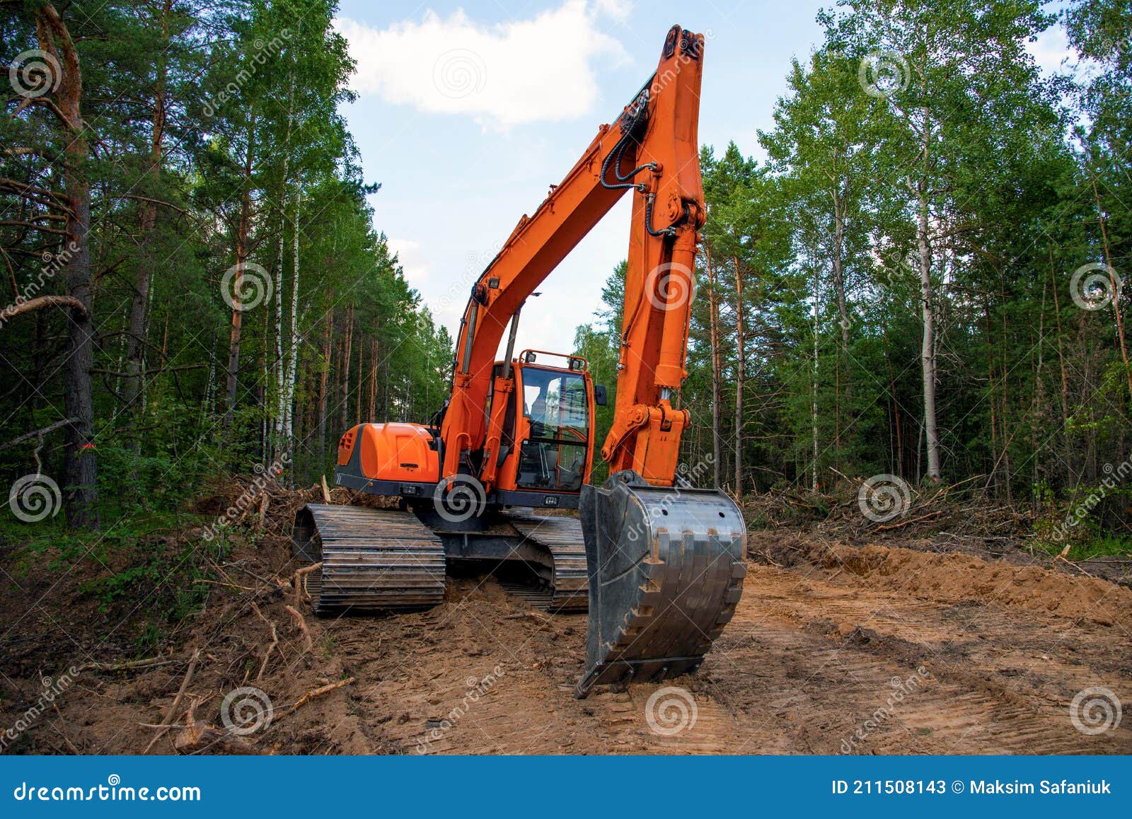 Excavator Clearing Forest for New Development. Orange Backhoe Modified ...
