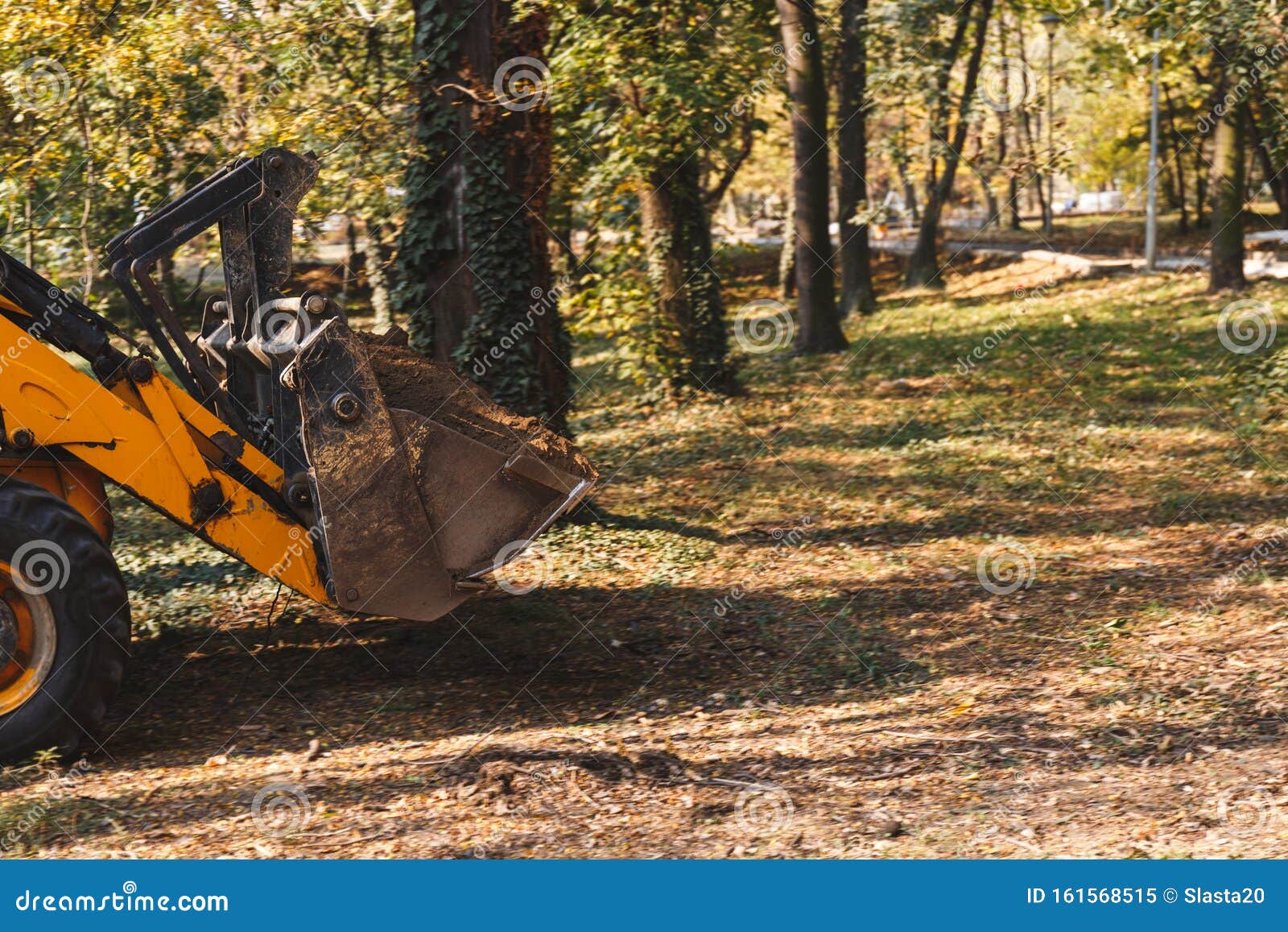 Excavator Clearing Ground on a Building Site. Forest Road Construction ...