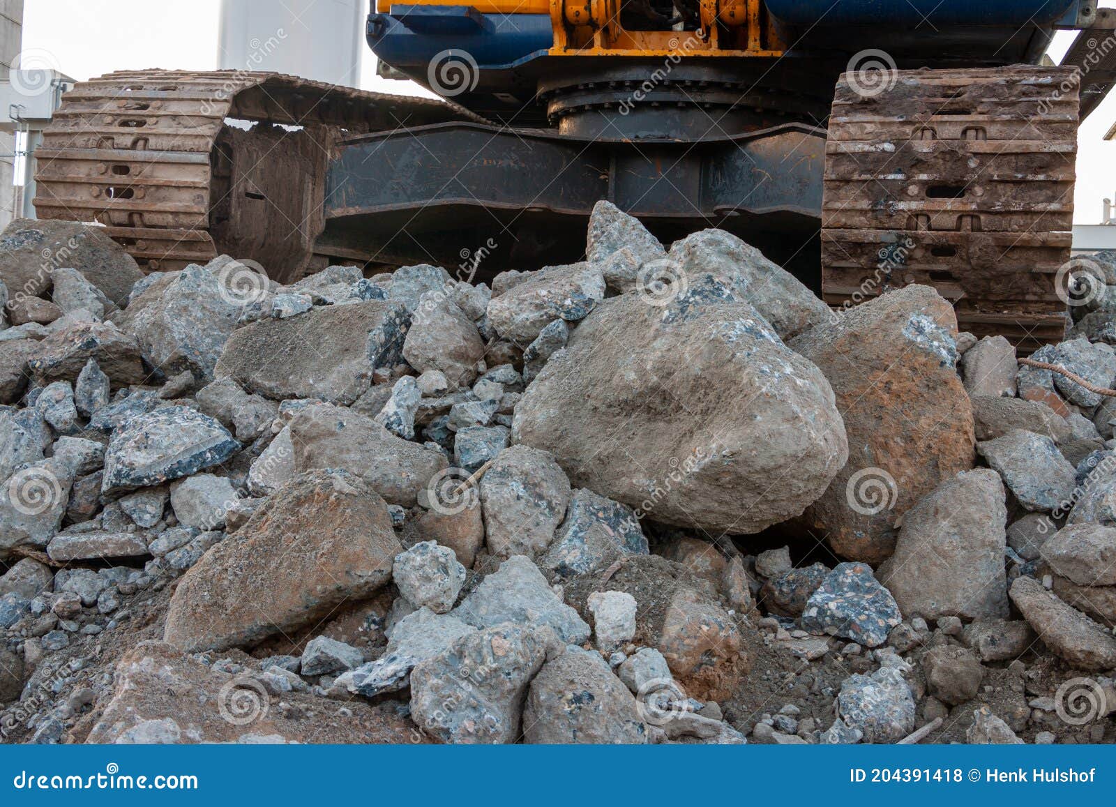Concrete Waste Bin Filled With Trash Standing On A Sidewalk Covered In ...
