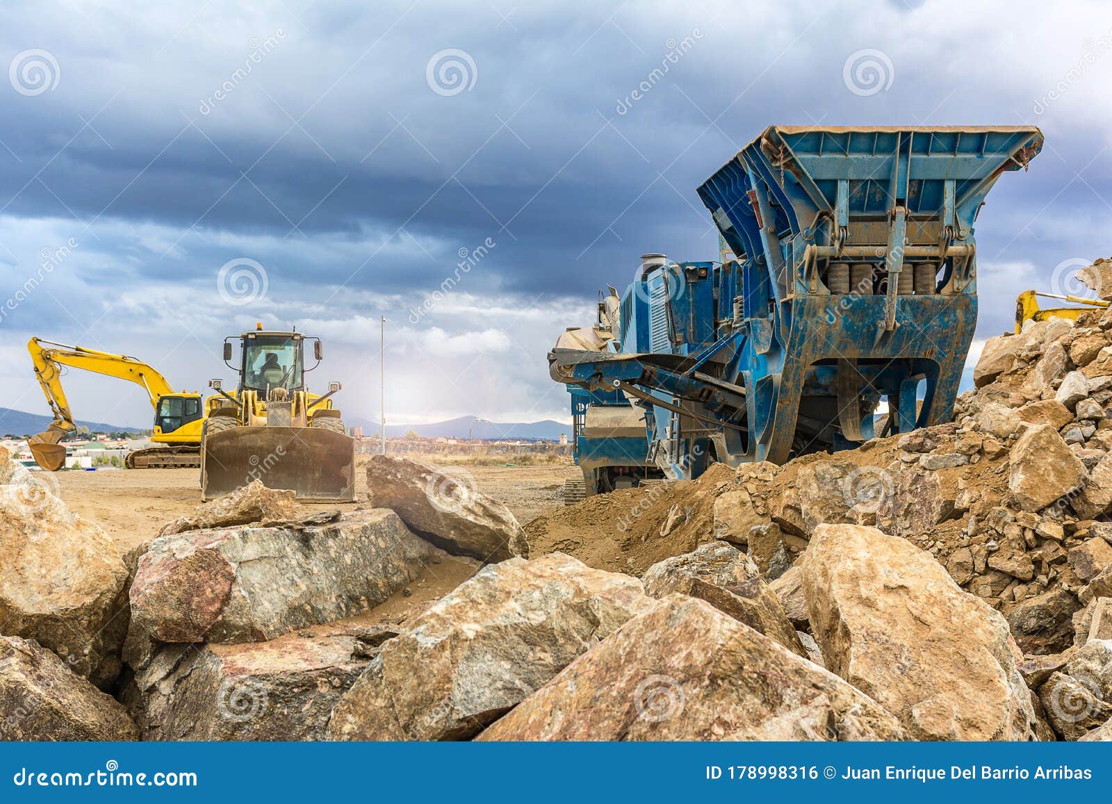 Excavator Collecting Stone in an Open-cast Mine Stock Photo - Image of ...