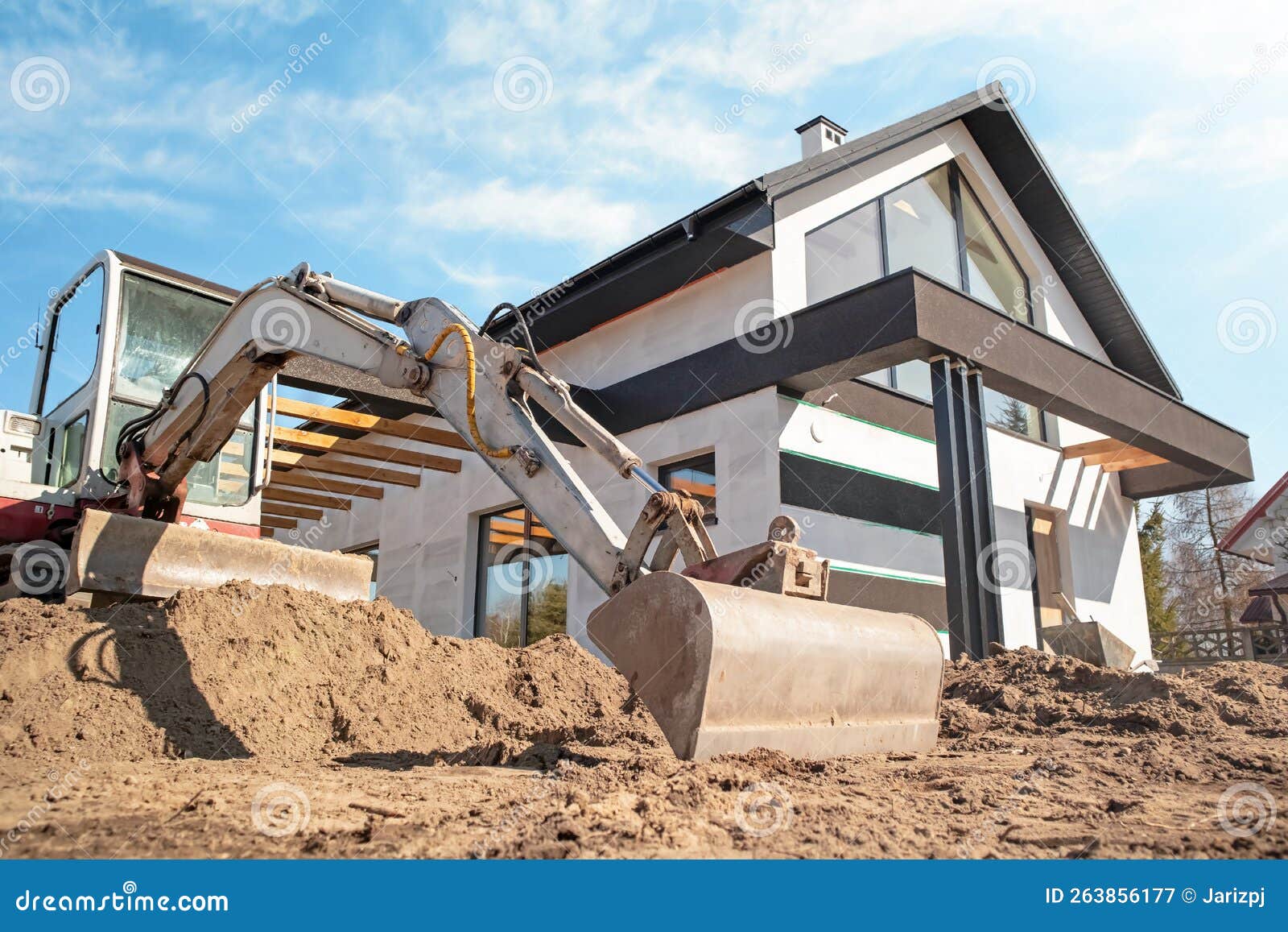 Excavator at the Construction of a New House, during Earthworks. Stock ...