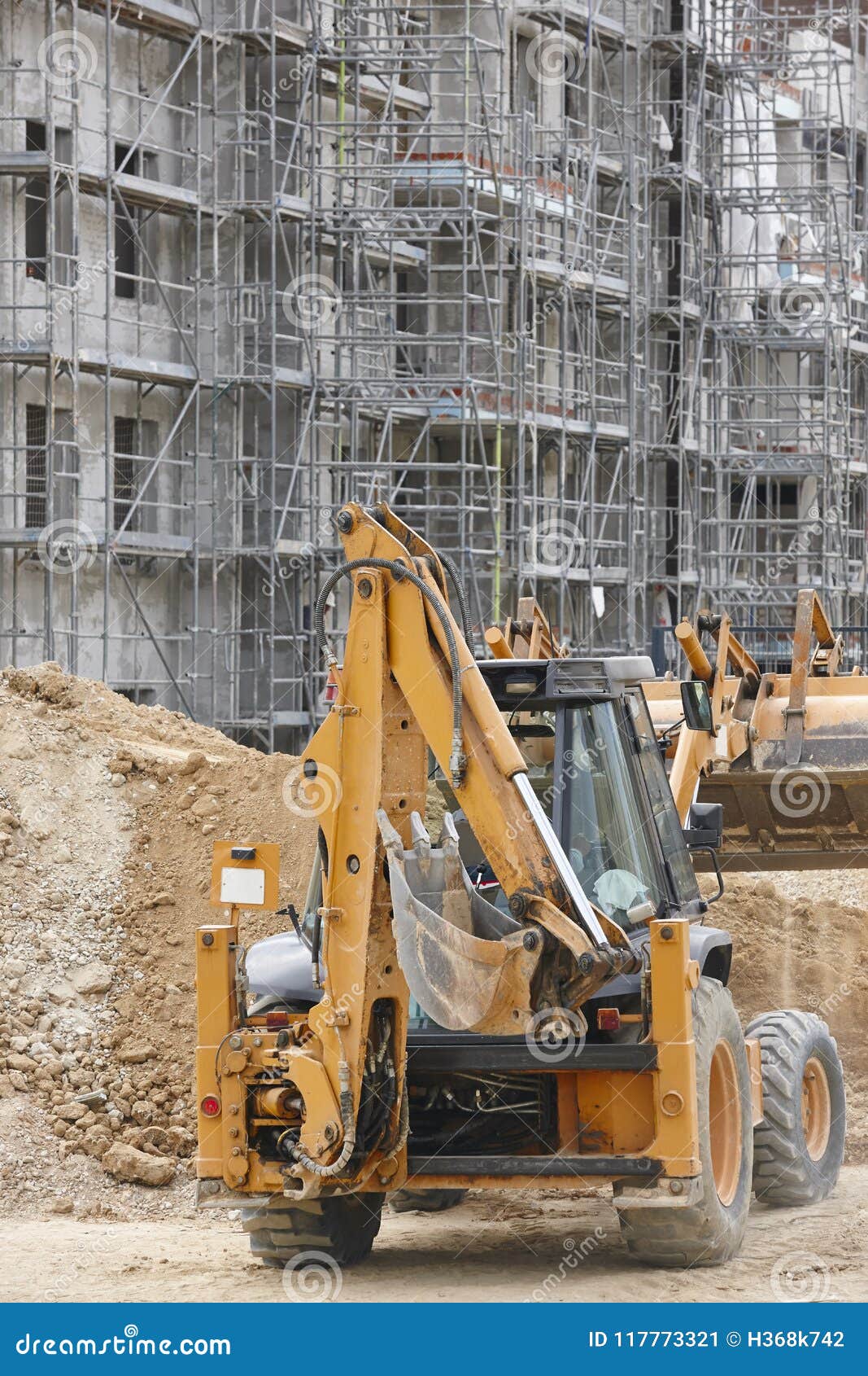 Excavator on a Construction Site. Building in Progress Stock Image ...