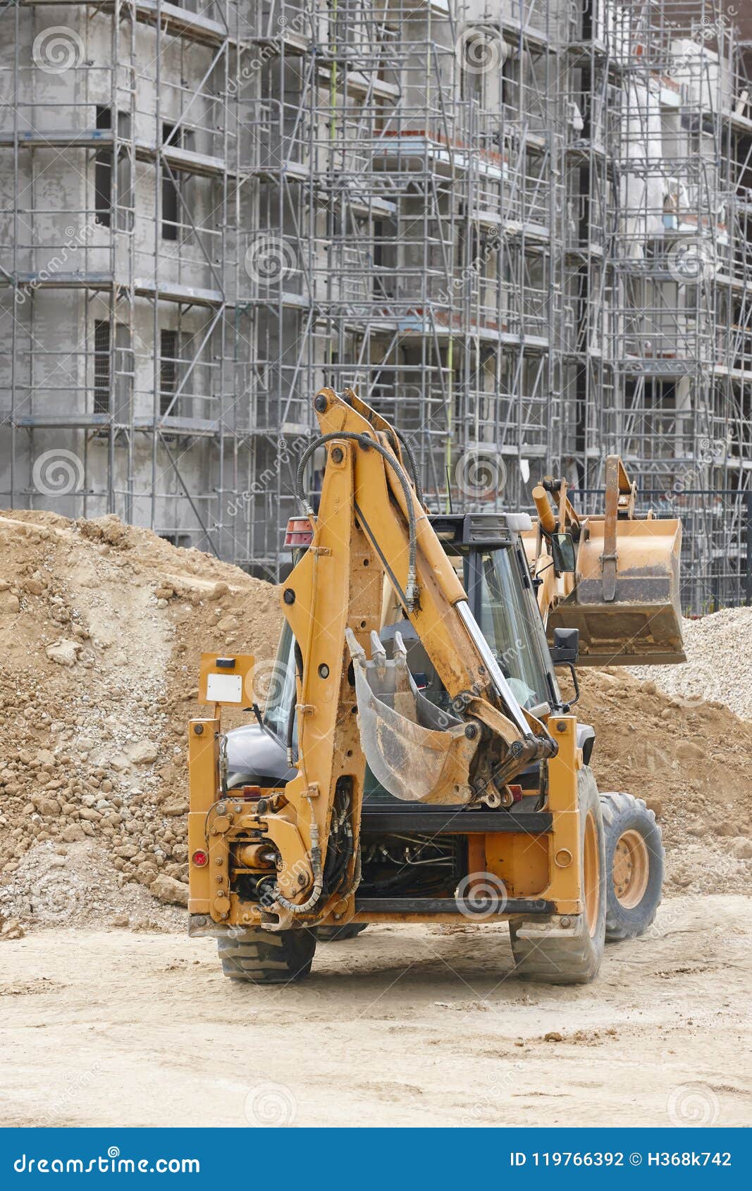 Excavator on a Construction Site. Building in Progress Stock Photo ...