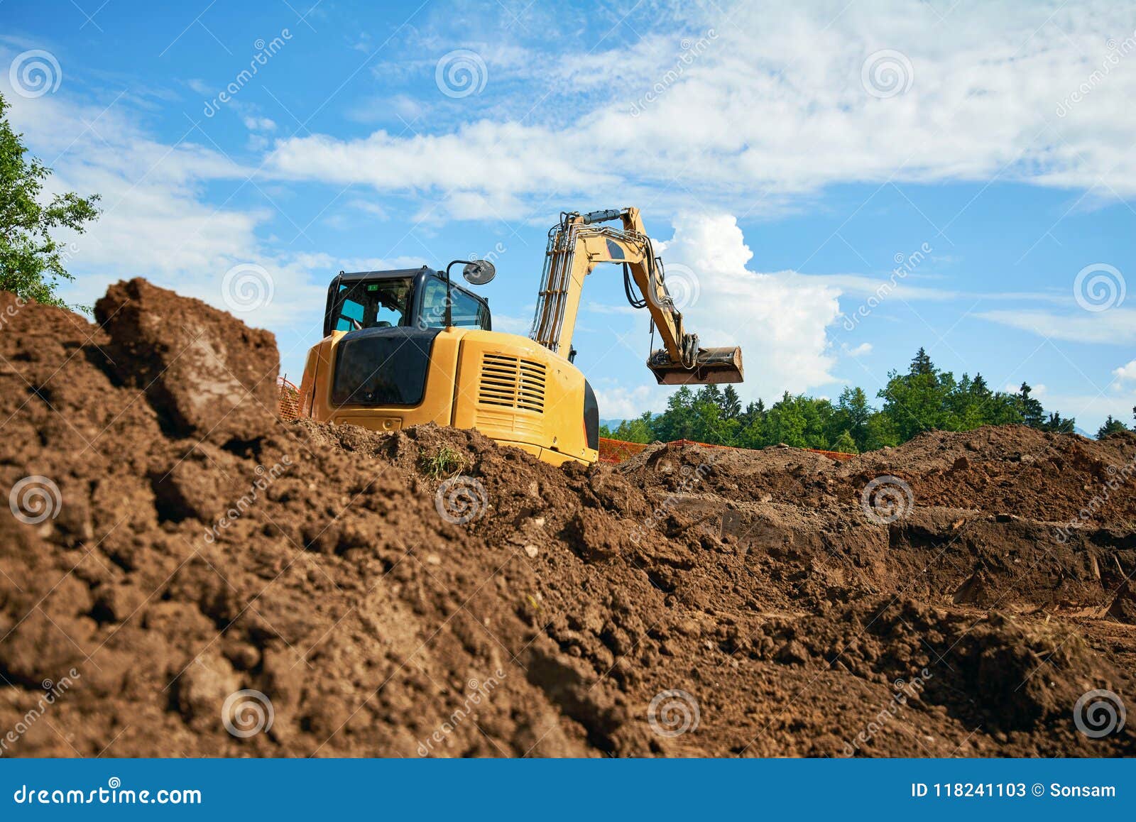 Excavator at Construction Site - Digging Foundations for House Stock ...