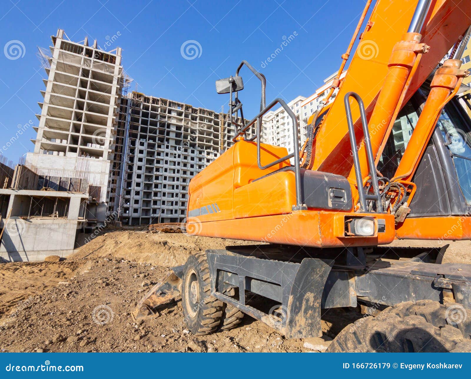 Excavator at the Construction Site of a Multi-storey Building, Fragment ...