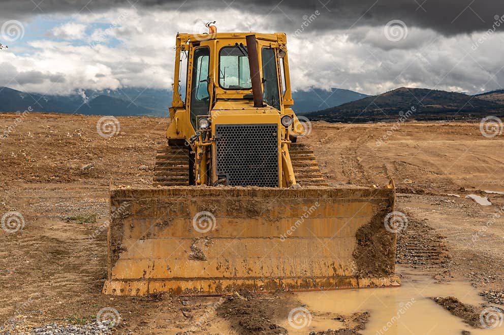 Excavator at a Construction Site, Performing Earth Moving Work Stock ...