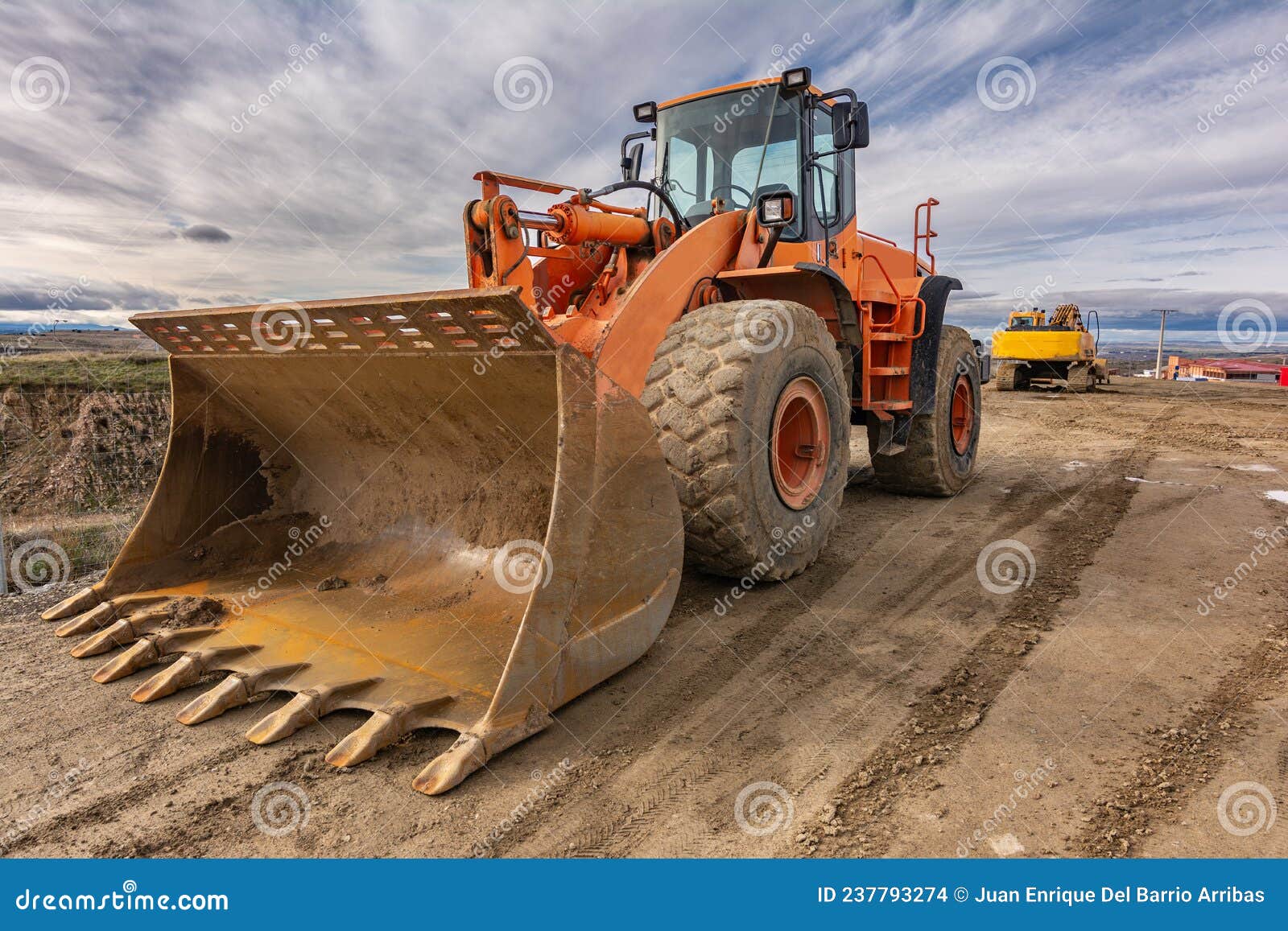 Excavator at a Construction Site, Performing Earth Moving Work Stock ...