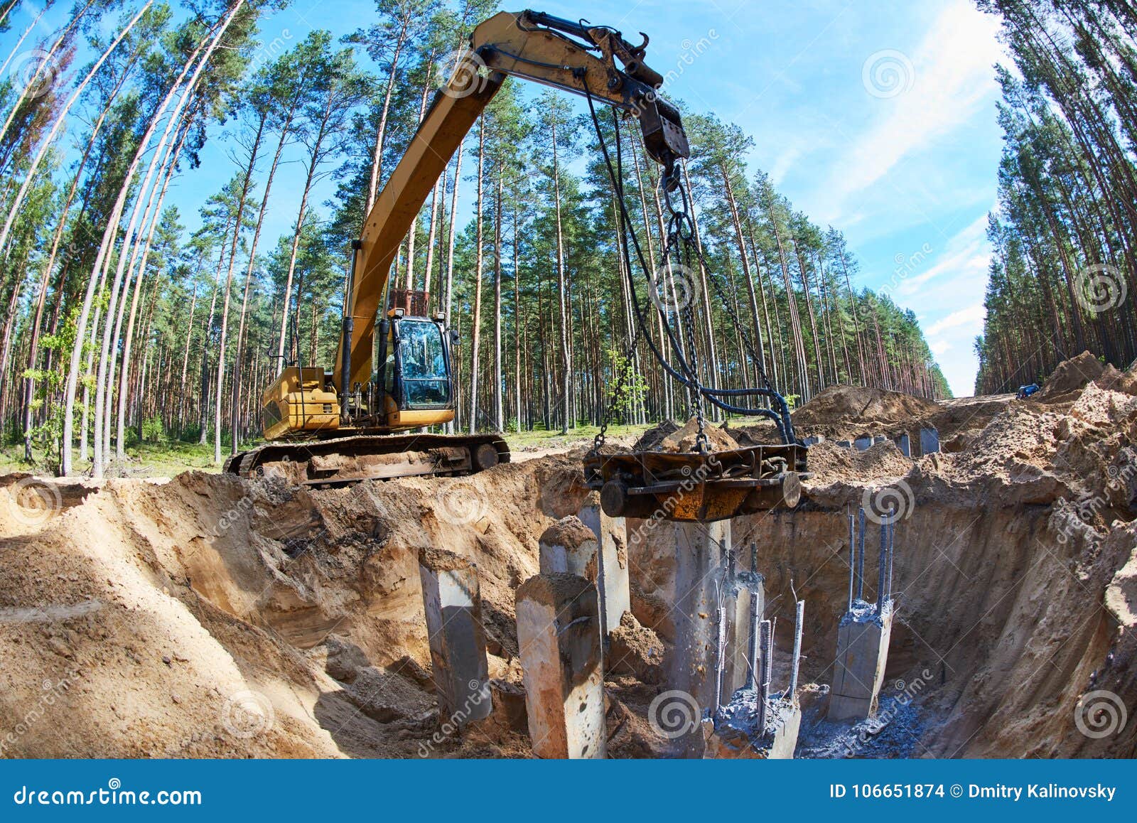 Excavator Cutting Concrete Pole during Foundation Construction Stock ...