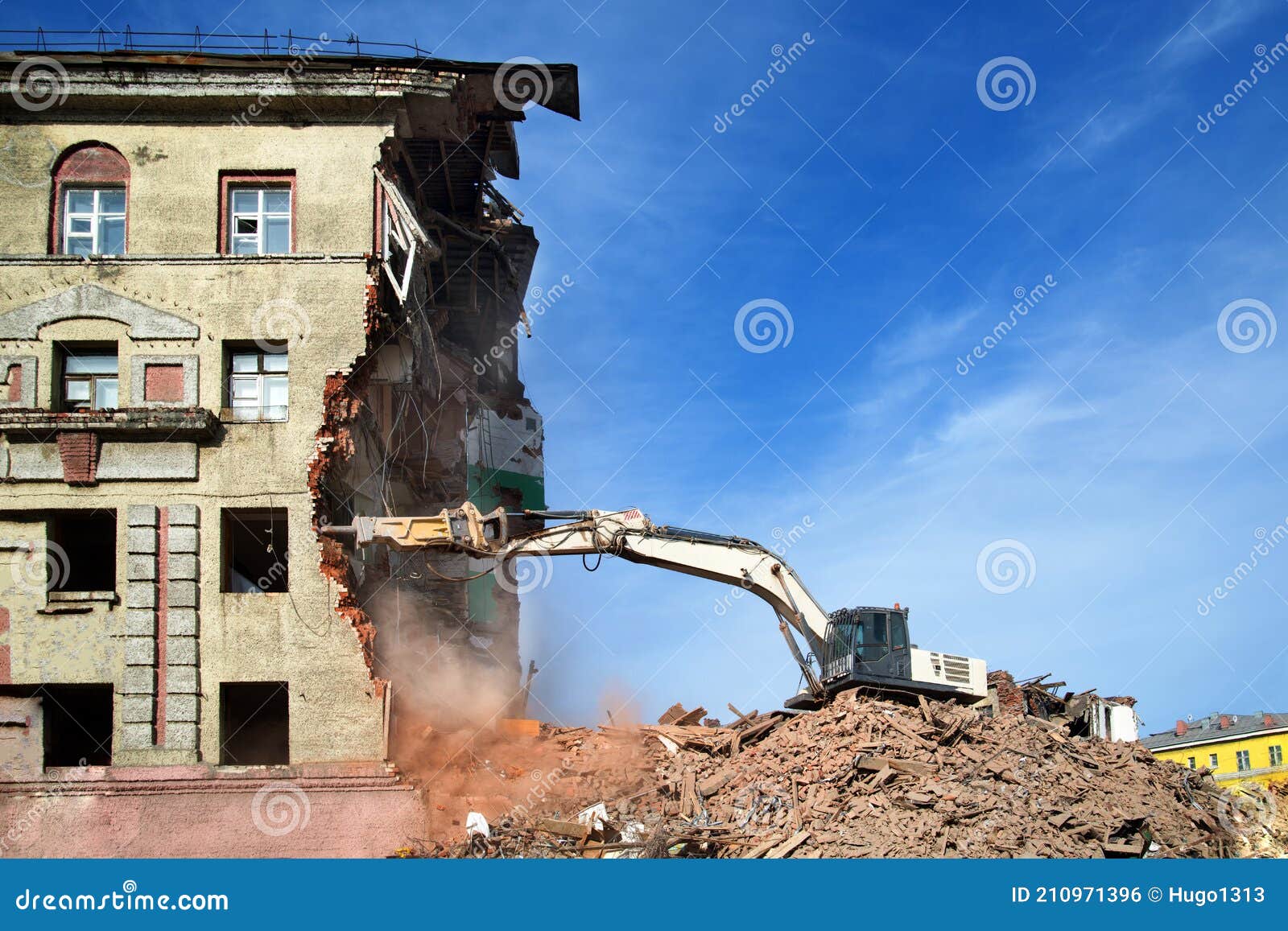 Excavator Demolishing a Brick Building. Machinery Demolishing Building ...