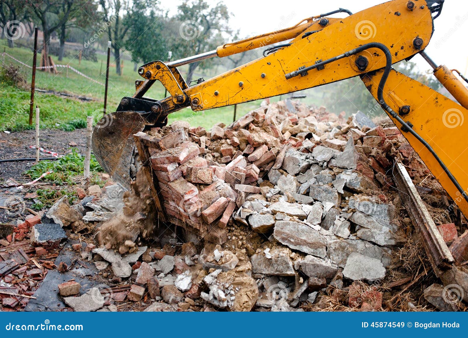 Excavator On Demolition The Old Building. Backhoe The Destruction Of ...