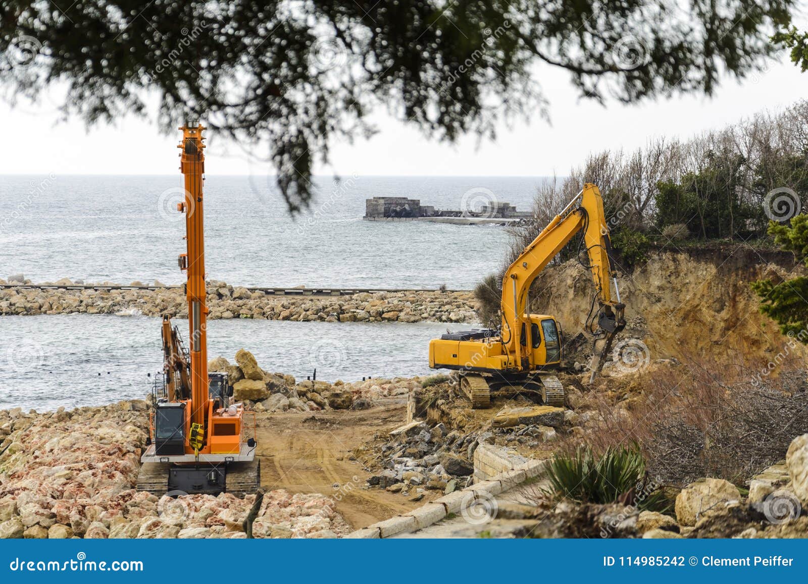 Excavator Destroying a Beach and a Cliff for a Hotel Construction ...