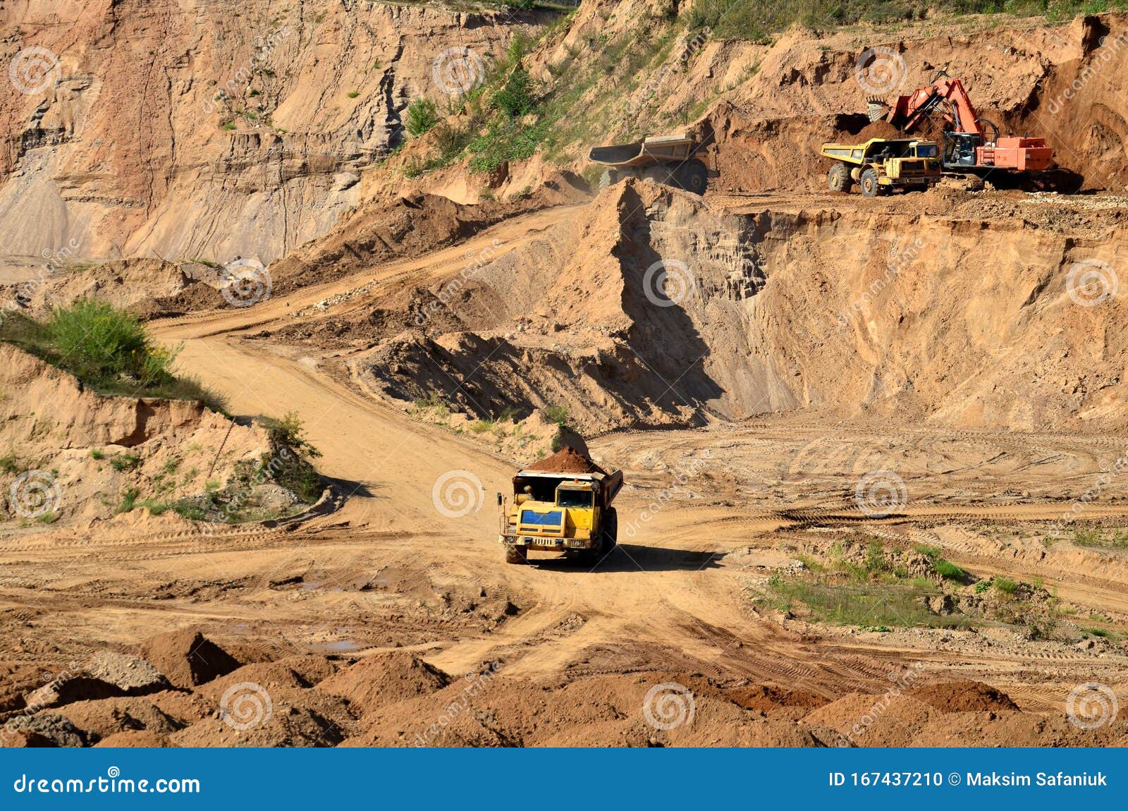 Mining, Loading Coal Into A Dump Truck With An Excavator. Editorial ...