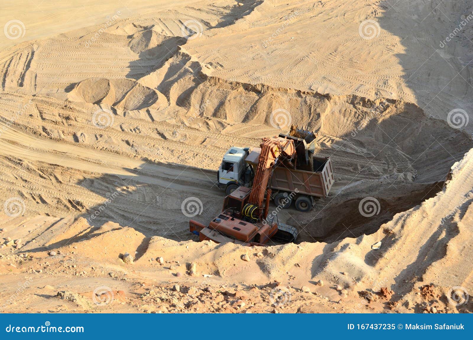 Mining, Loading Coal Into A Dump Truck With An Excavator. Editorial ...