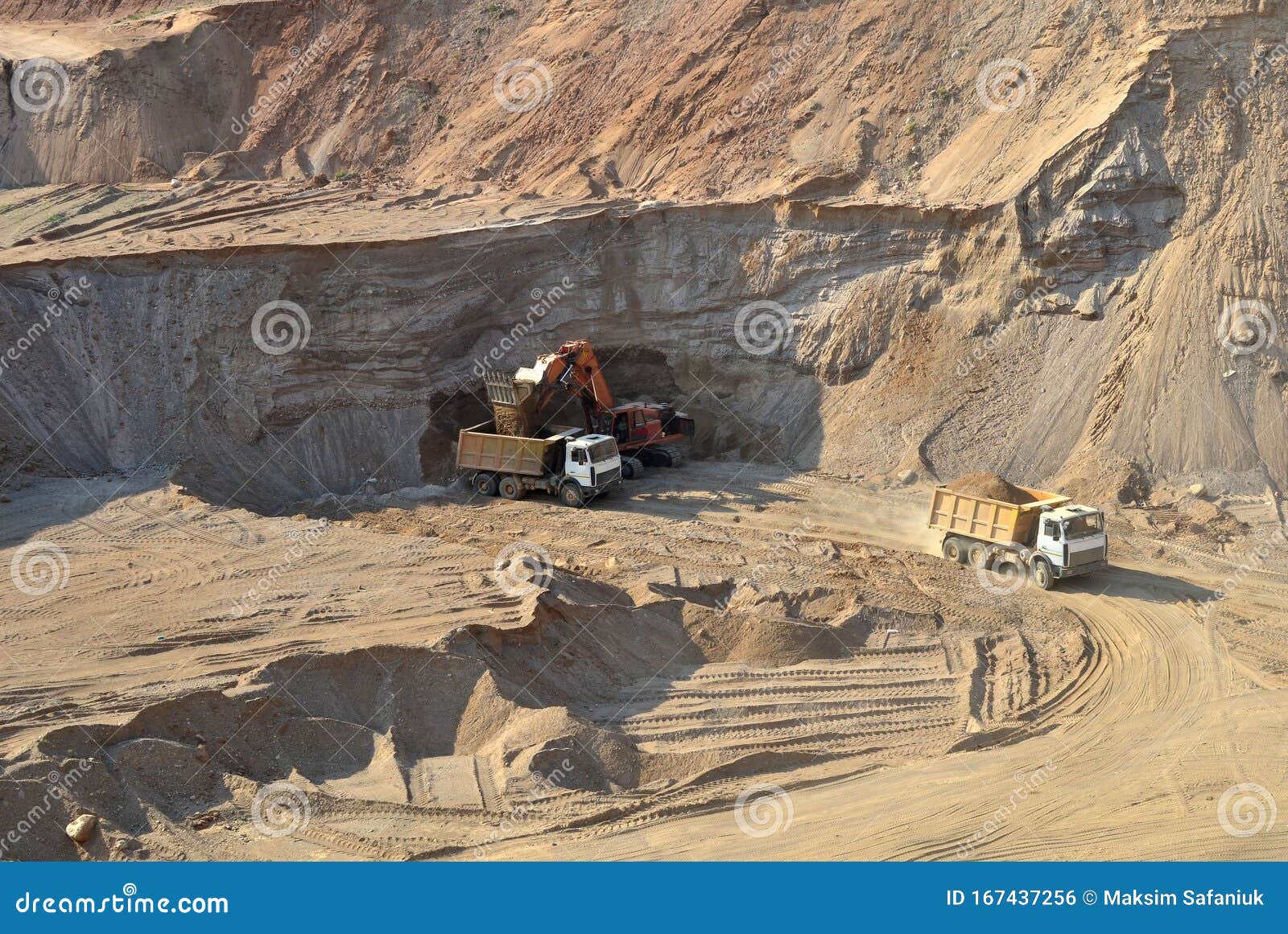 Mining, Loading Coal Into A Dump Truck With An Excavator. Editorial ...
