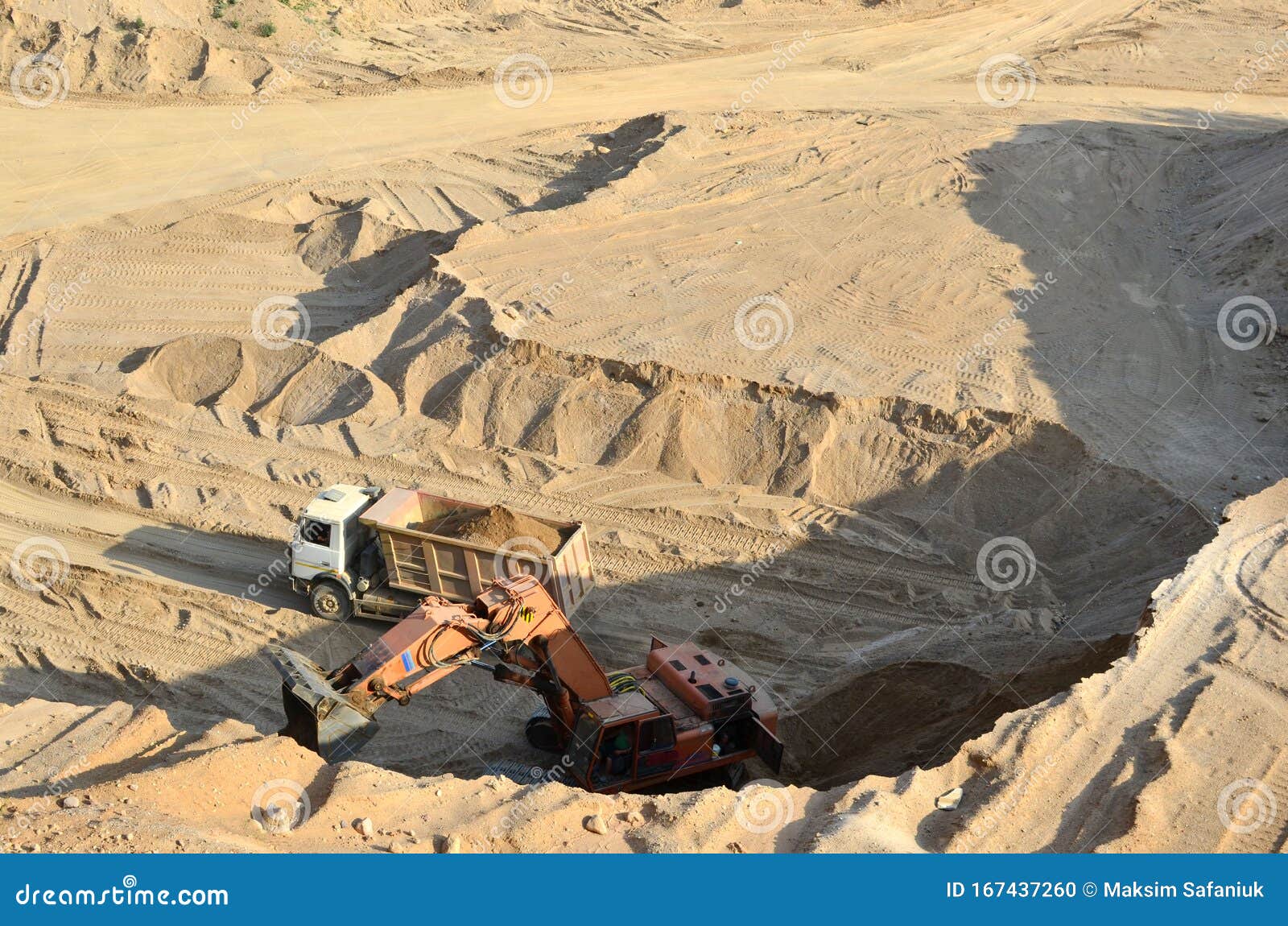 Mining, Loading Coal Into A Dump Truck With An Excavator. Editorial ...