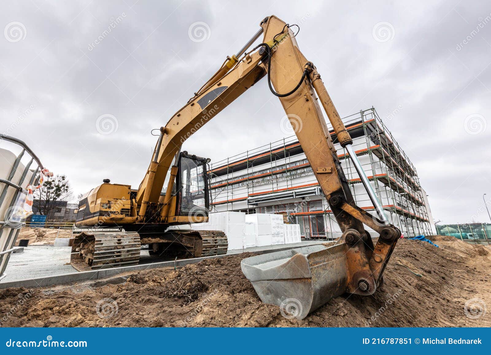 Excavator Digger With A Huge Bucket At A Construction Site Royalty-Free ...