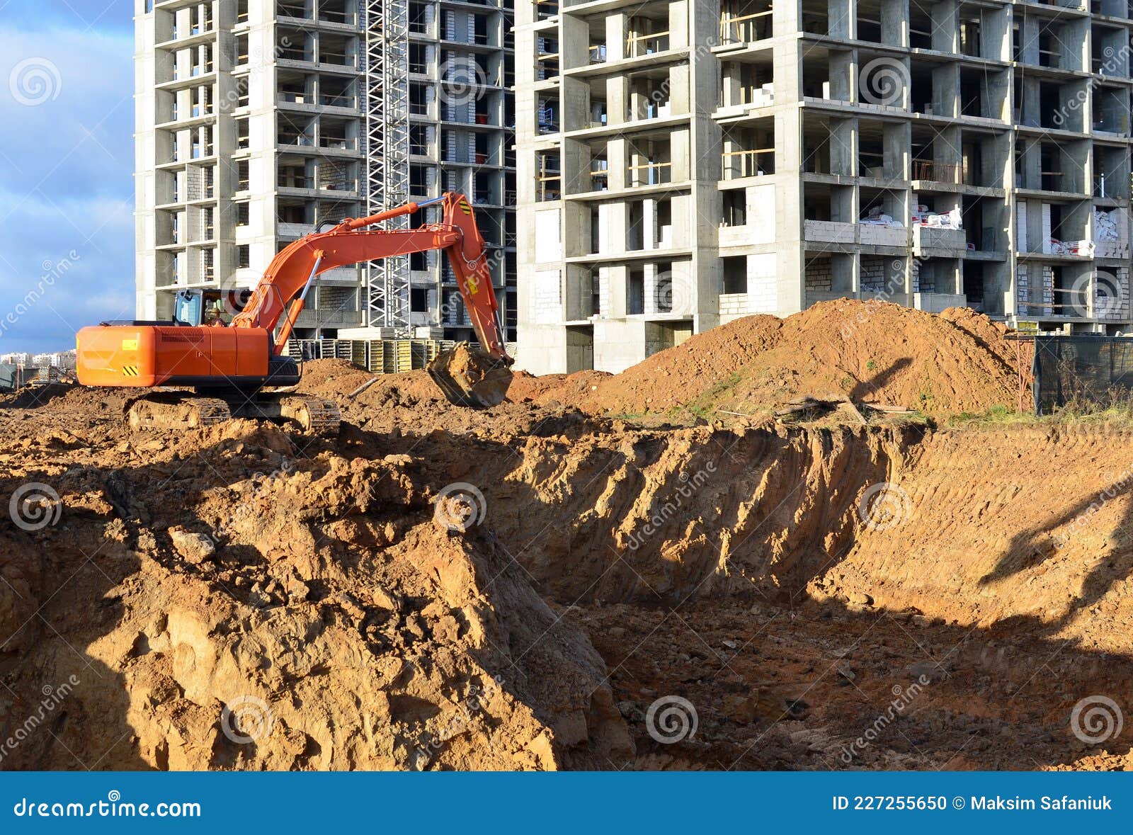 Excavator Digging Foundation at Construction Site. Heavy Machinery for ...