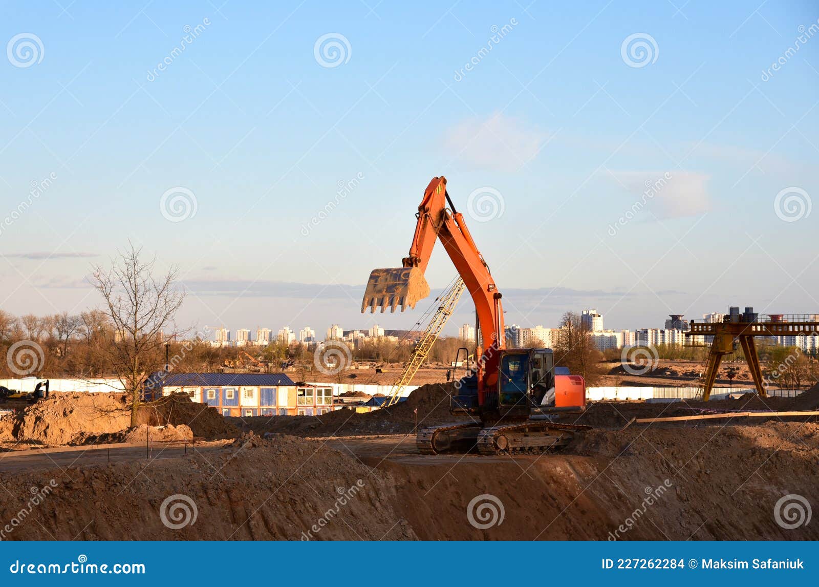 Excavator Digging Foundation at Construction Site. Heavy Machinery for ...