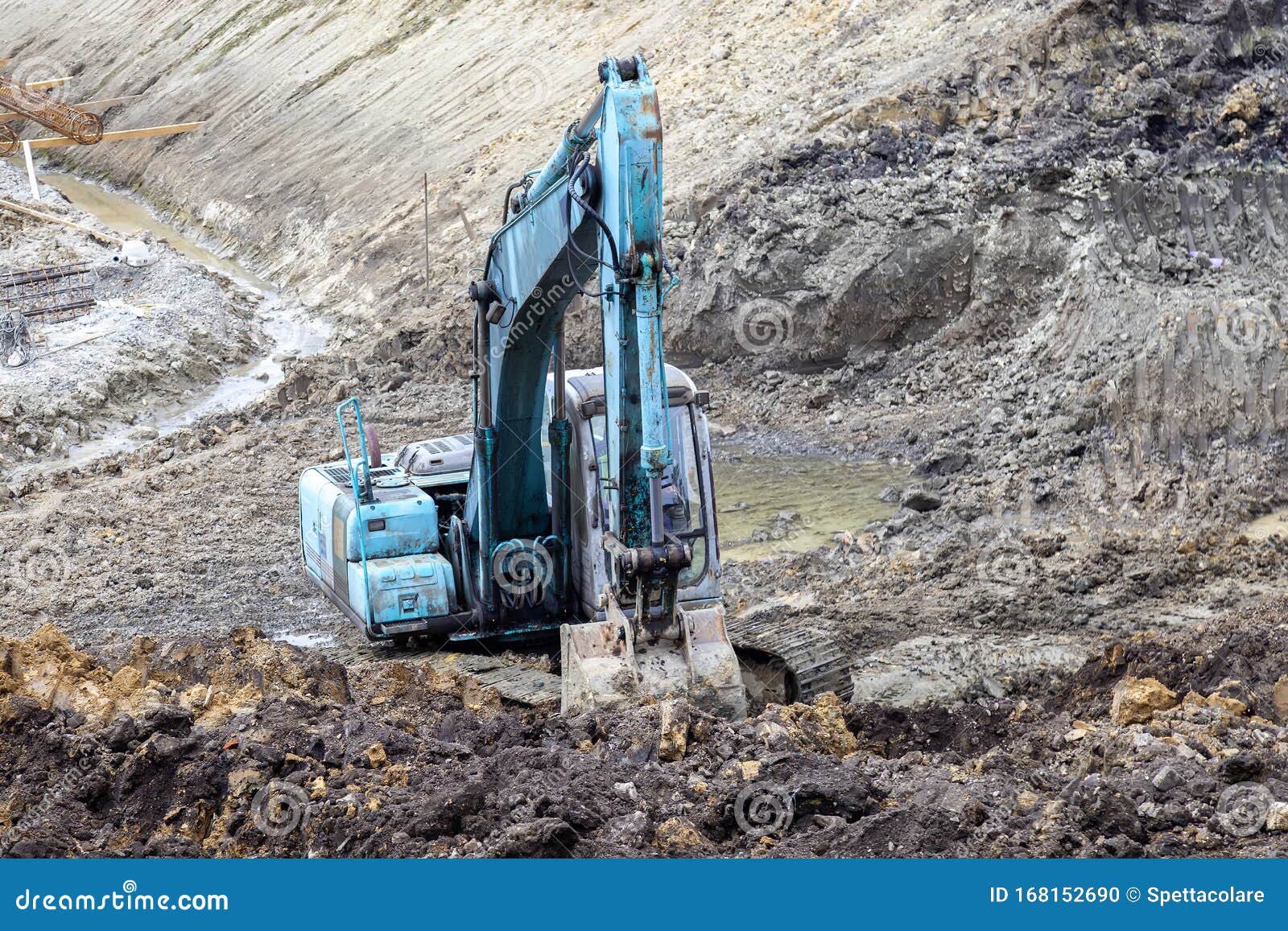 Digging The Pit Foundation A Hole With Excavator At The Construction ...