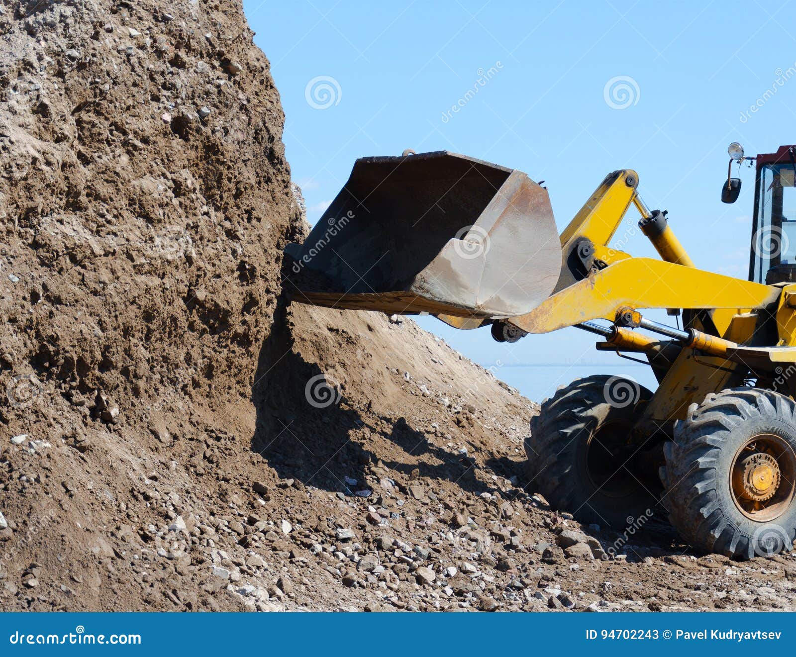 Excavator Digging Gravel Pile for Loading in the Truck Stock Image ...