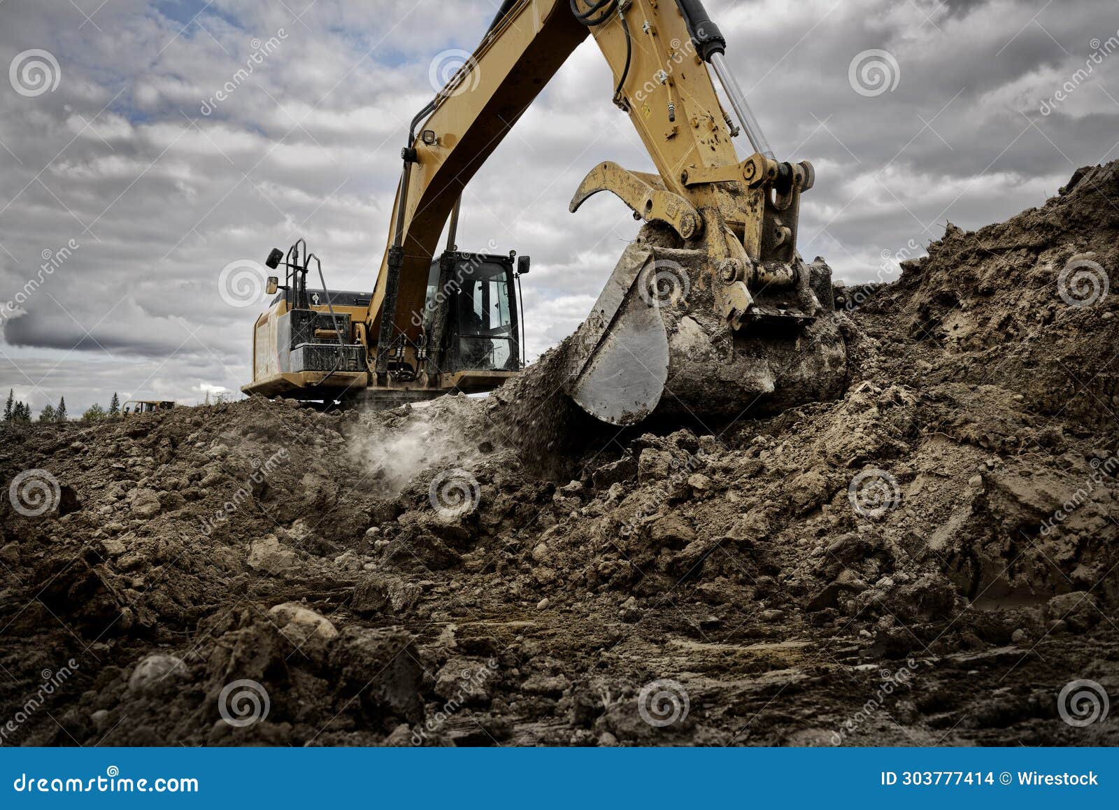 Excavator Digging into the Ground with Its Large Bucket Stock Photo ...