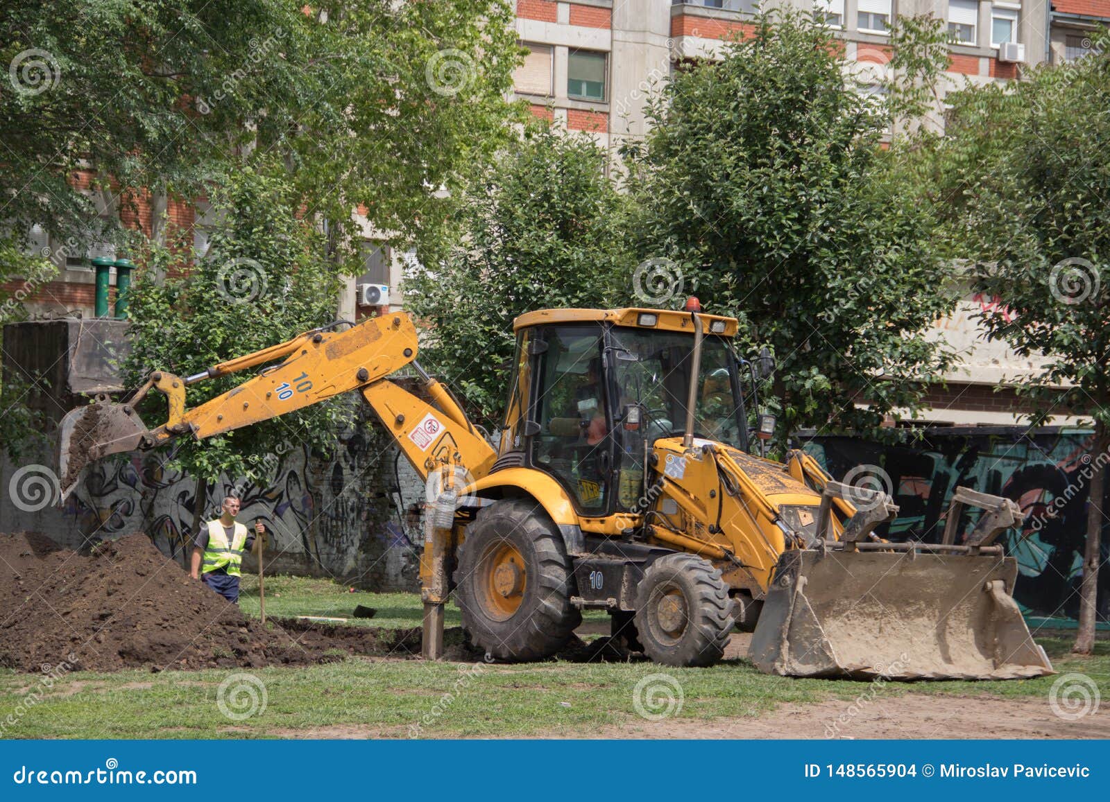 Excavator Digging the Ground and Man at Work Editorial Stock Image ...