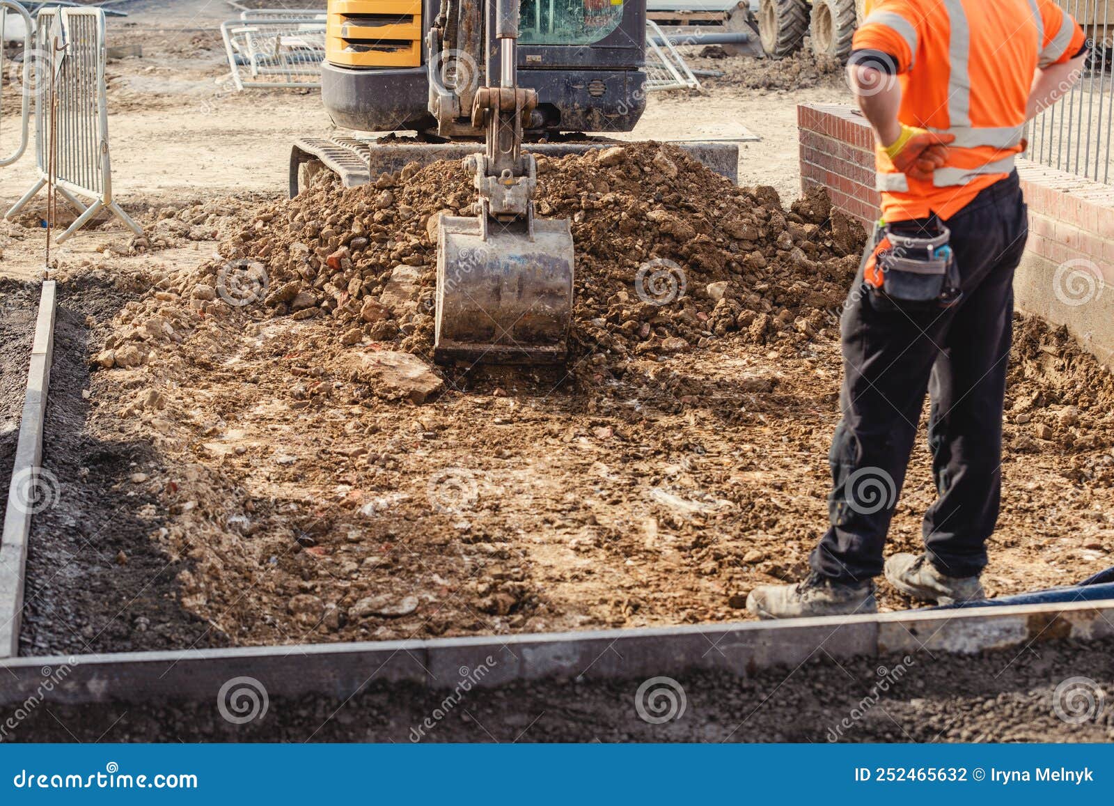 Excavator Digging the Ground for New Driveway and Footpath. Stock Photo ...