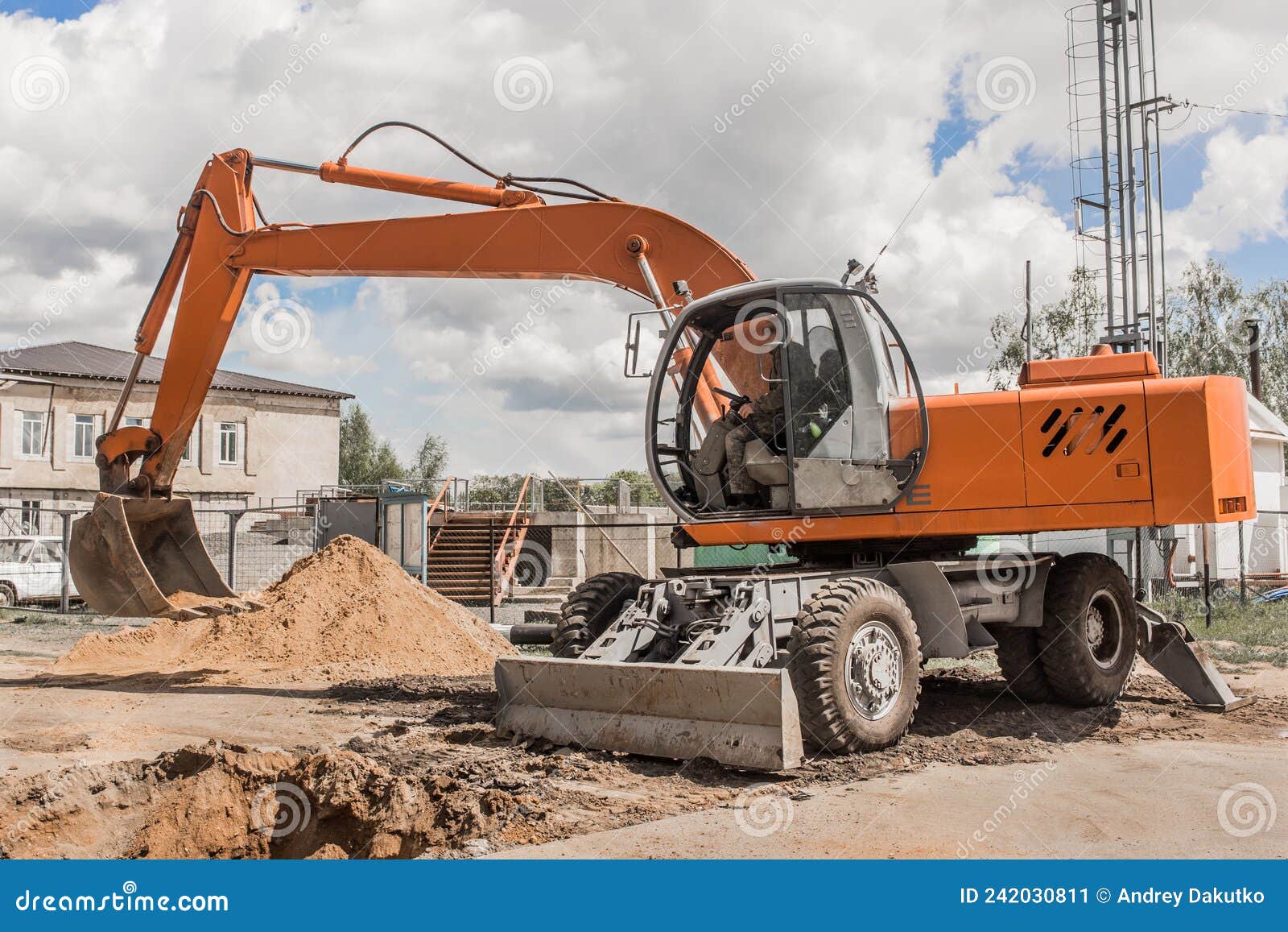Excavator Digging Heavy Earth Work on an Industrial Machine on a ...