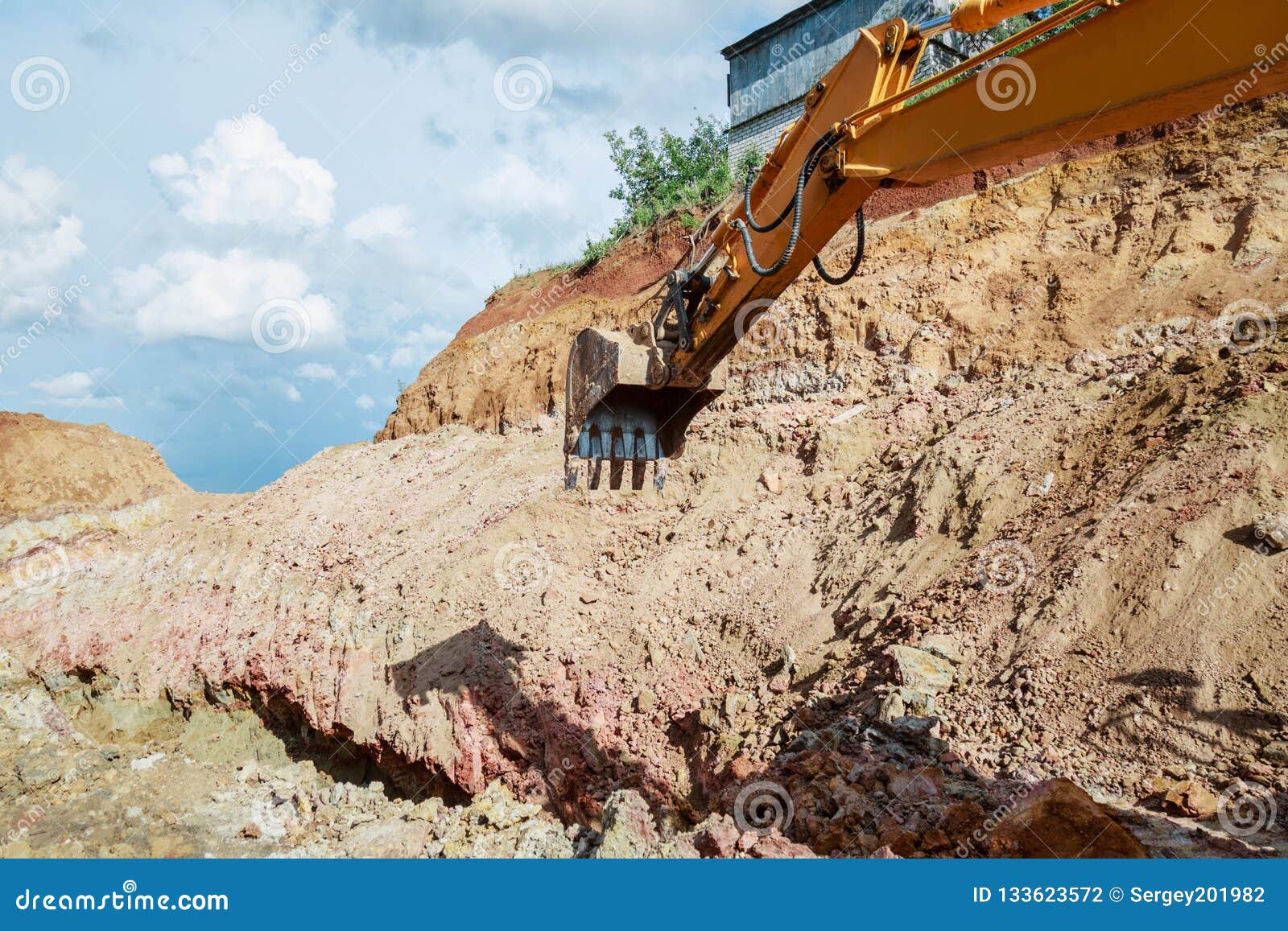 Excavator Digging a Hole. Earthwork Stock Photo - Image of construction ...