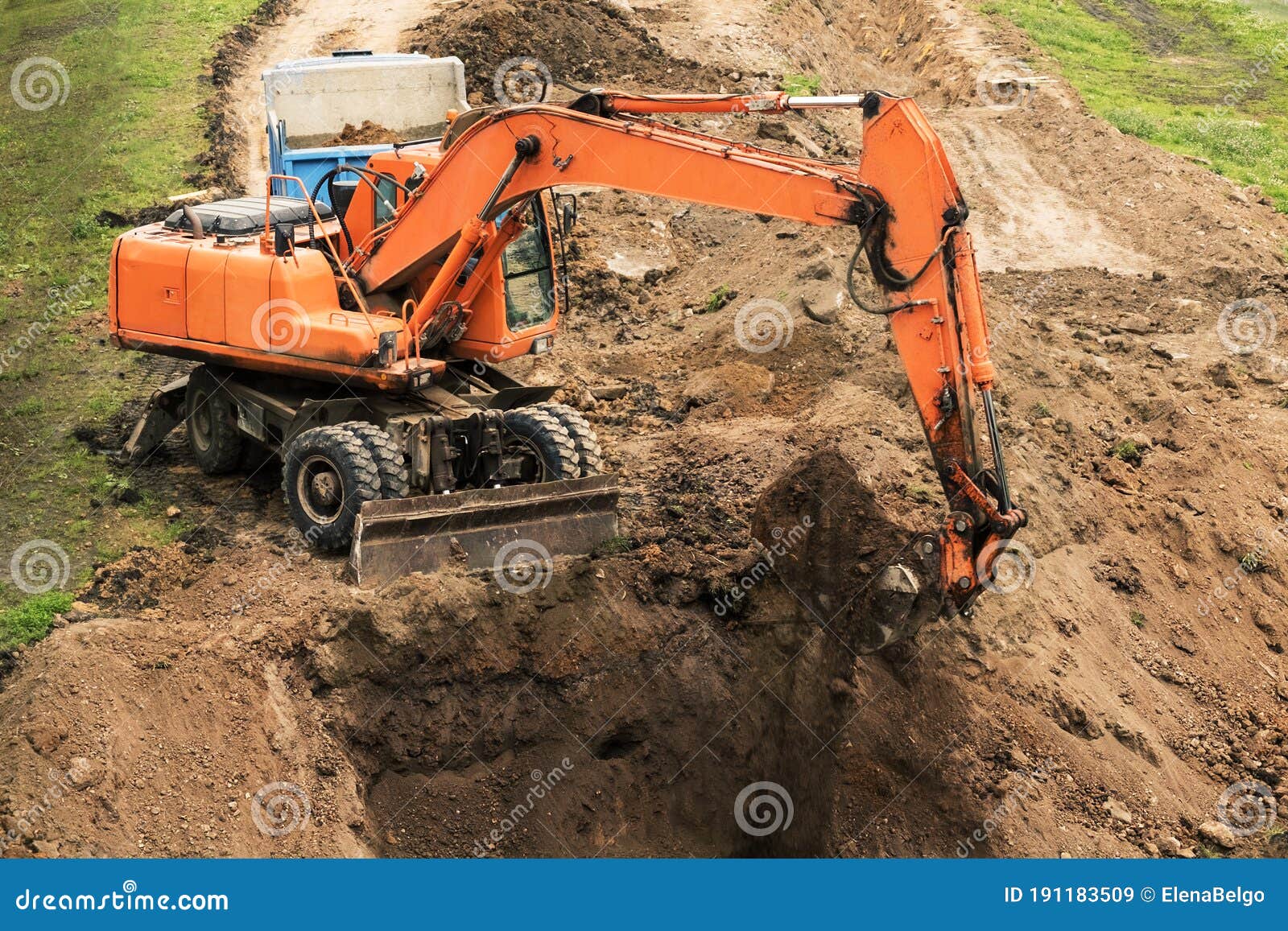Excavator is Digging a Large Pit in the Ground. Stock Image - Image of ...