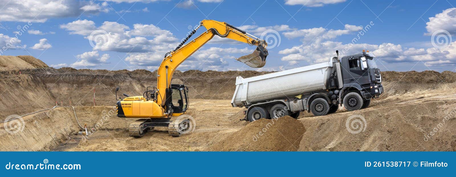 Excavator is Digging and Loading at Construction Site Stock Image ...