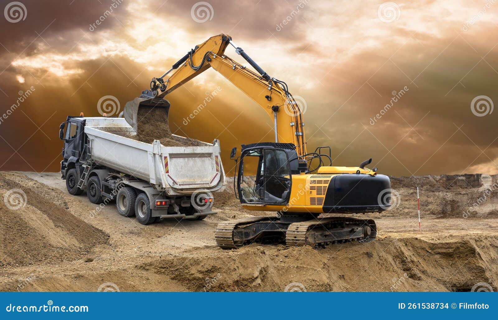 Excavator is Digging and Loading at Construction Site Stock Photo ...