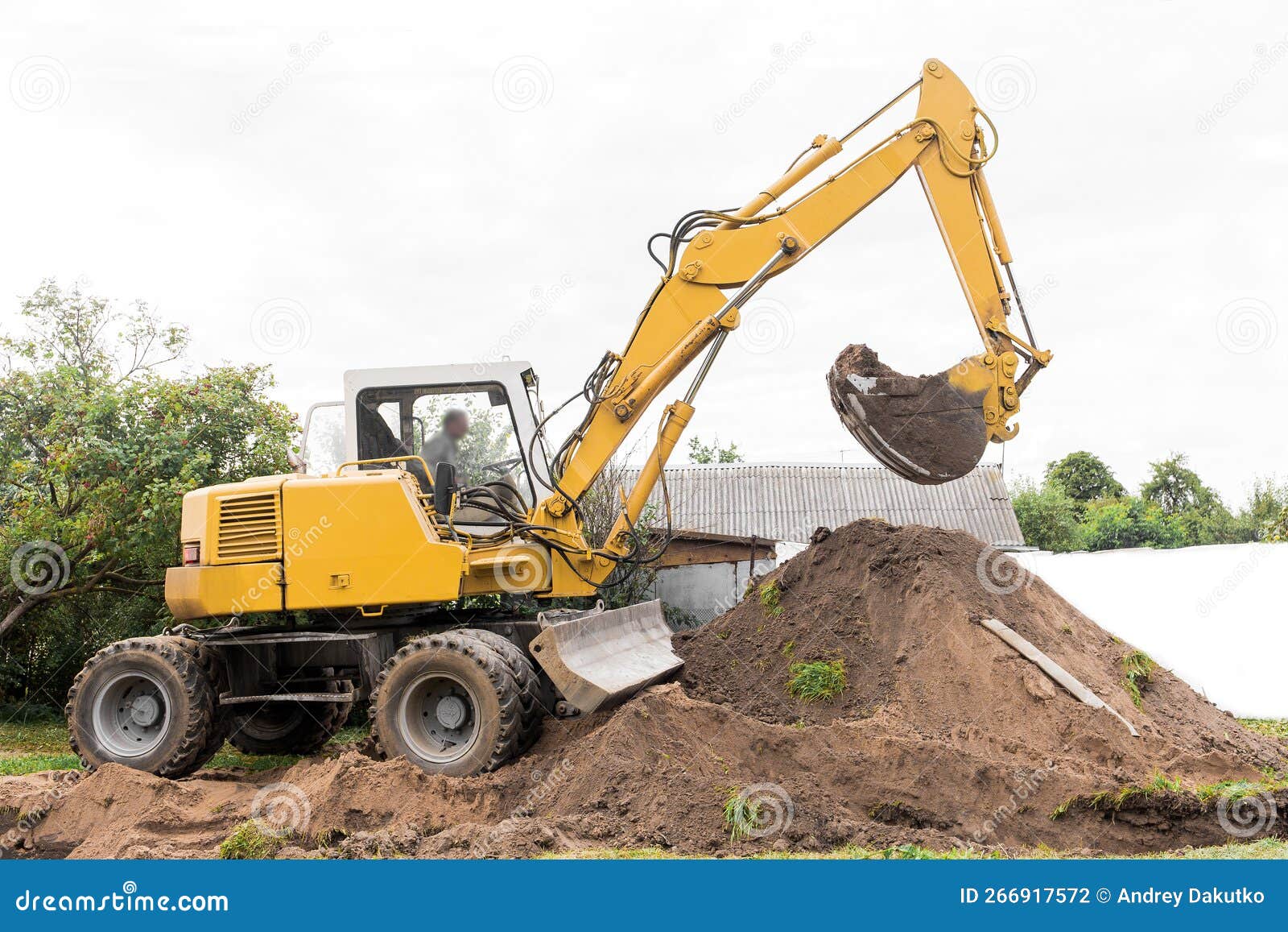 A Excavator is Digging on Outdoors in an Industrial Site. Excavation ...