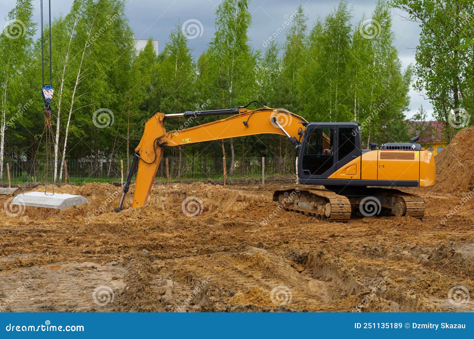 An Excavator is Digging a Pit for a House. Stock Image - Image of ...