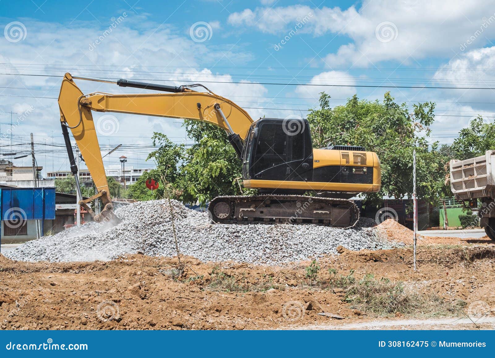 Excavator Digging Soil and Stone on Construction Site Stock Image ...