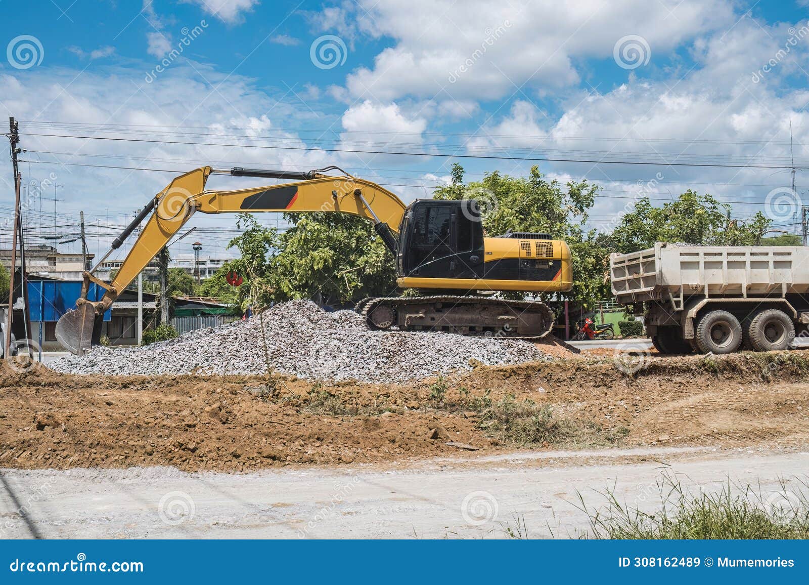 Excavator Digging Soil and Stone on Construction Site Stock Image ...