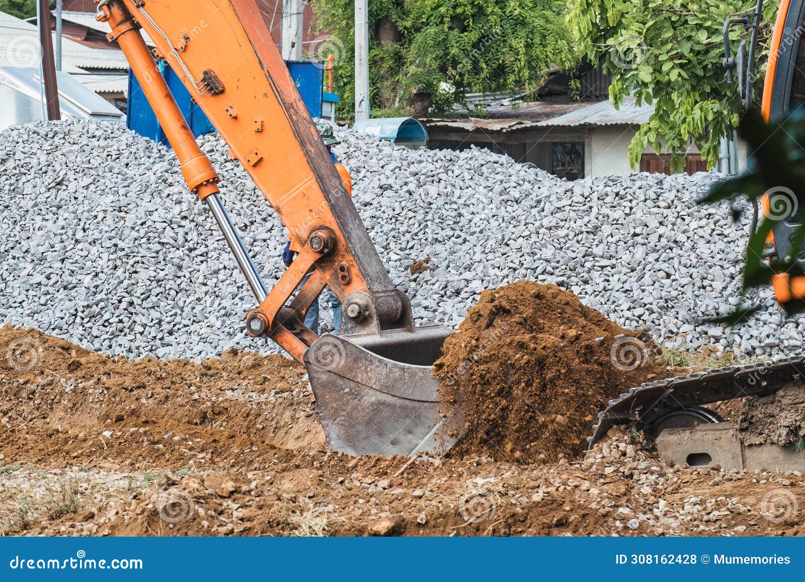 Excavator Digging Soil and Stone on Construction Site Stock Photo ...