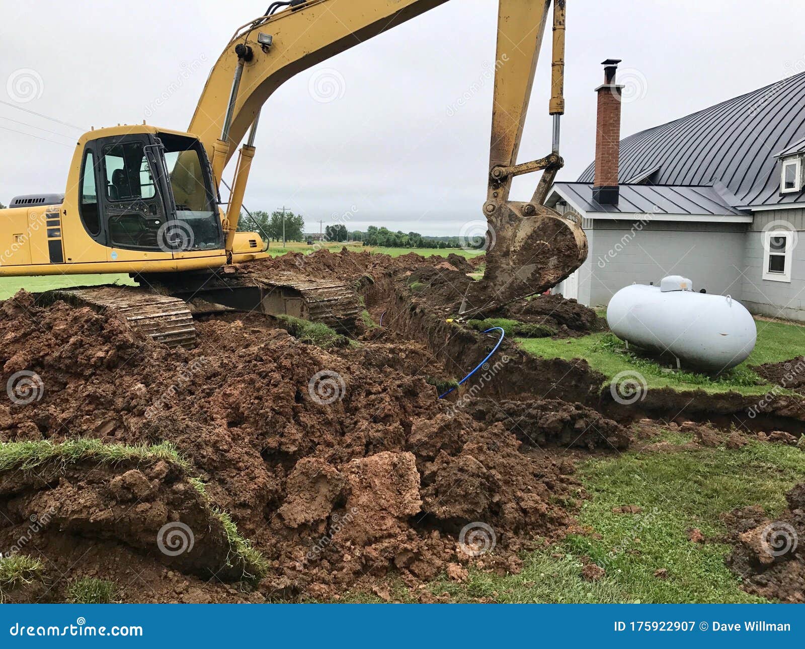 Excavator digging a trench stock image. Image of backhoe - 175922907