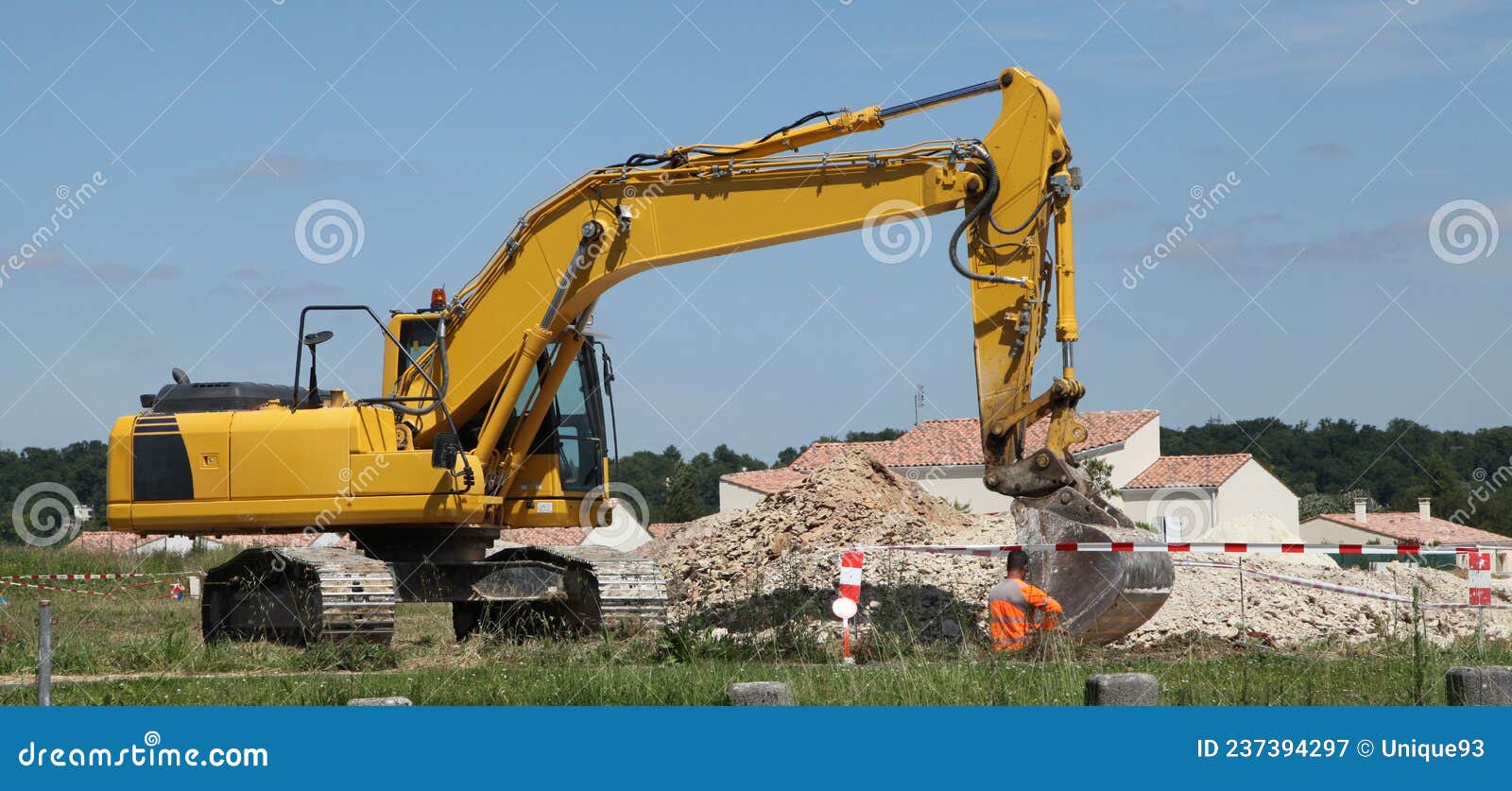 Excavator Digging a Trench with a Worker Stock Image - Image of ...