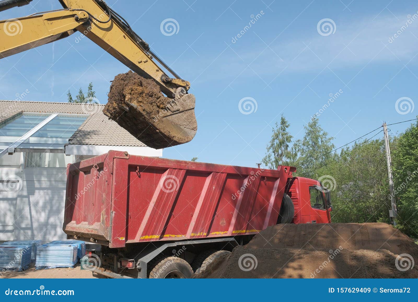 Excavator Digs Clay Soil at the Construction Site Stock Image - Image ...