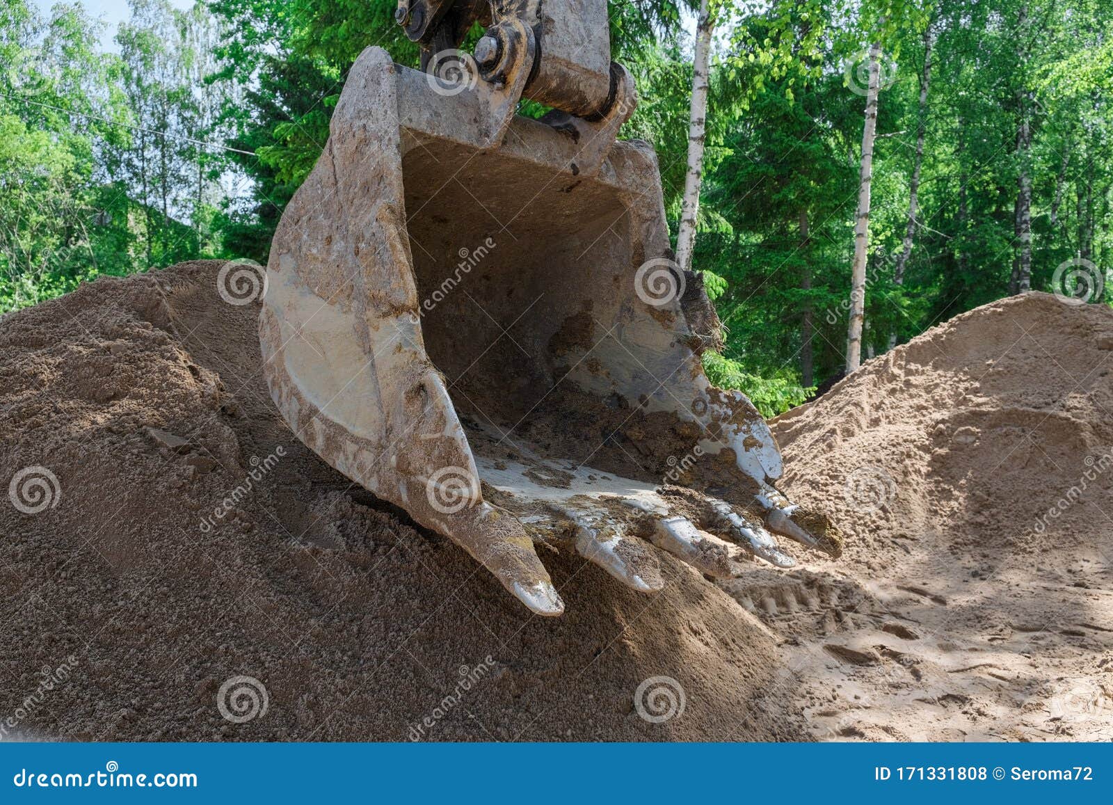 Excavator Digs Clay Soil at the Construction Site Stock Photo - Image ...