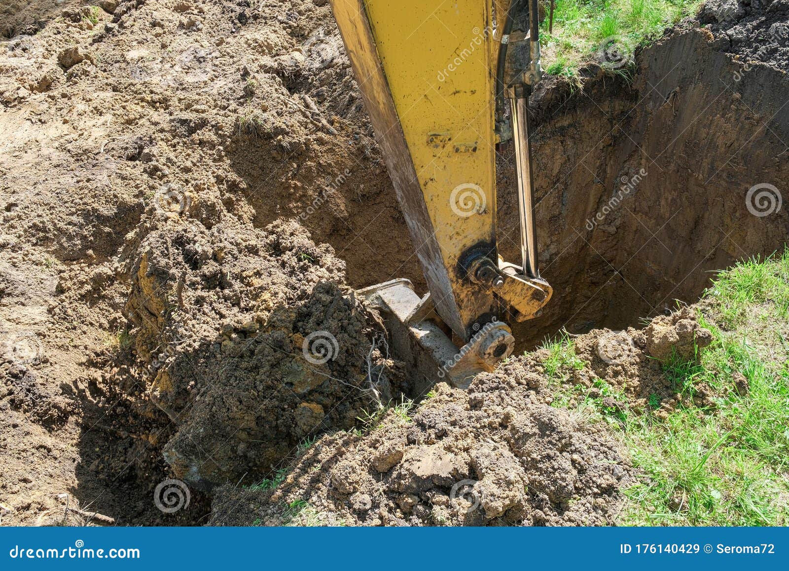 Excavator Digs Clay Soil at the Construction Site Stock Image - Image ...