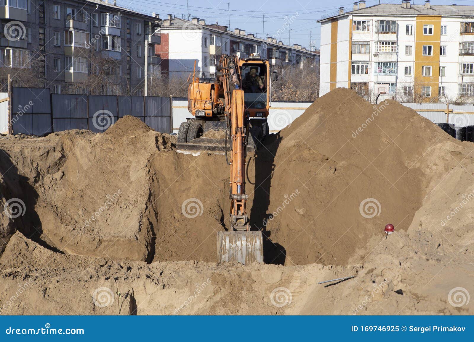 Excavator digs a pit stock image. Image of foundation - 169746925
