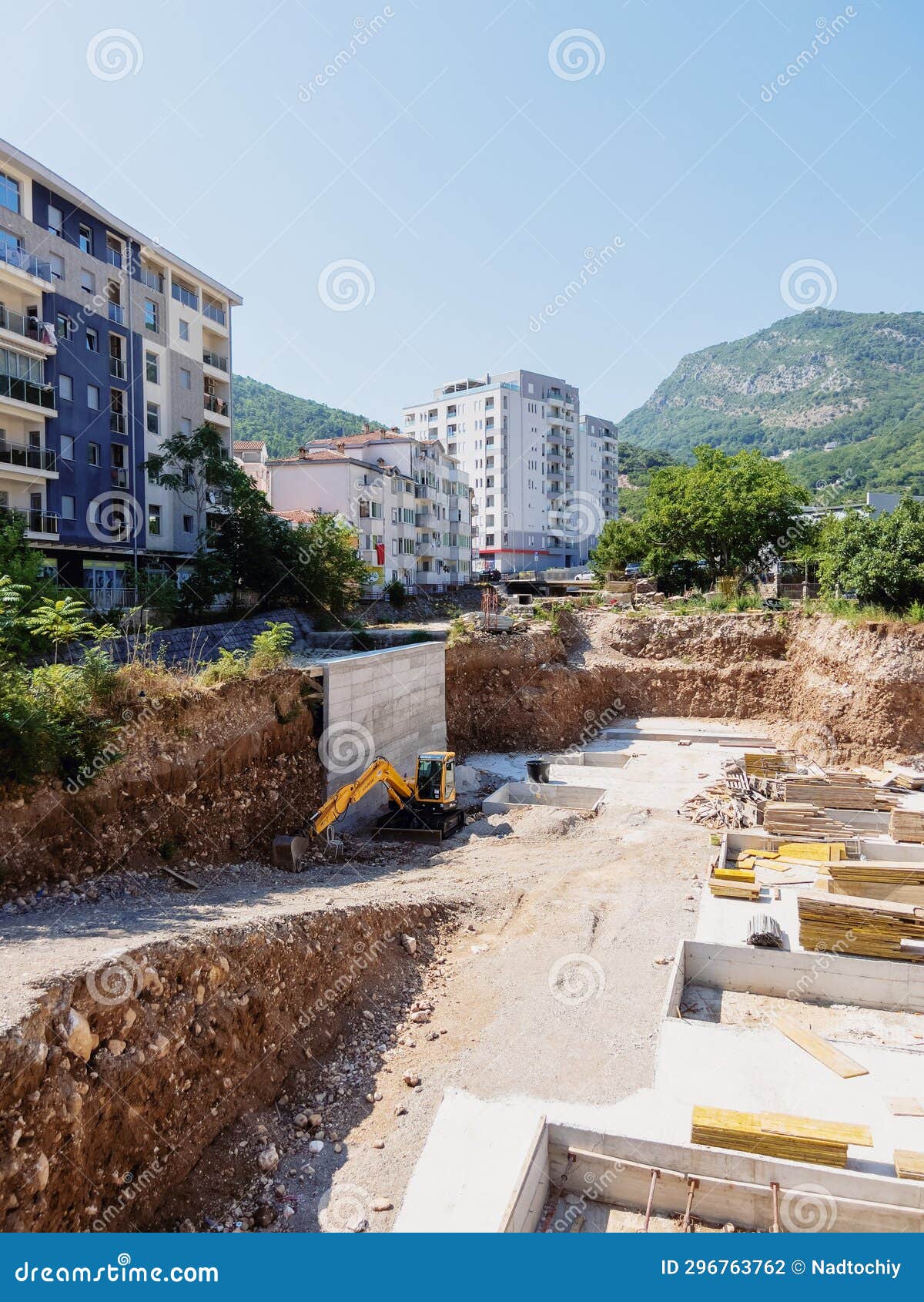 Excavator Digs the Ground at the Construction Site for the Foundation ...