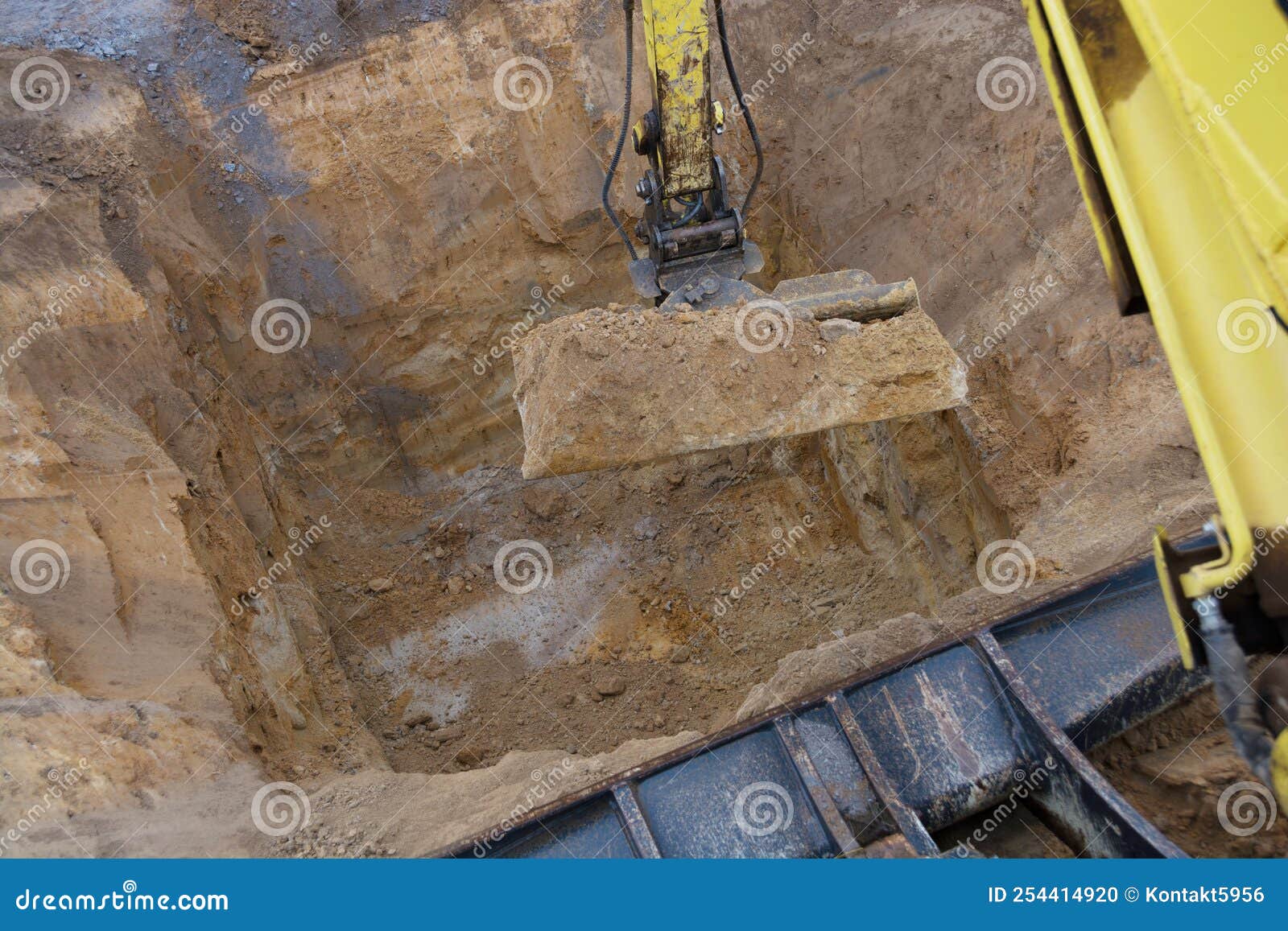 Excavator Digs Hole for Cistern Stock Photo - Image of dredging, dredge ...