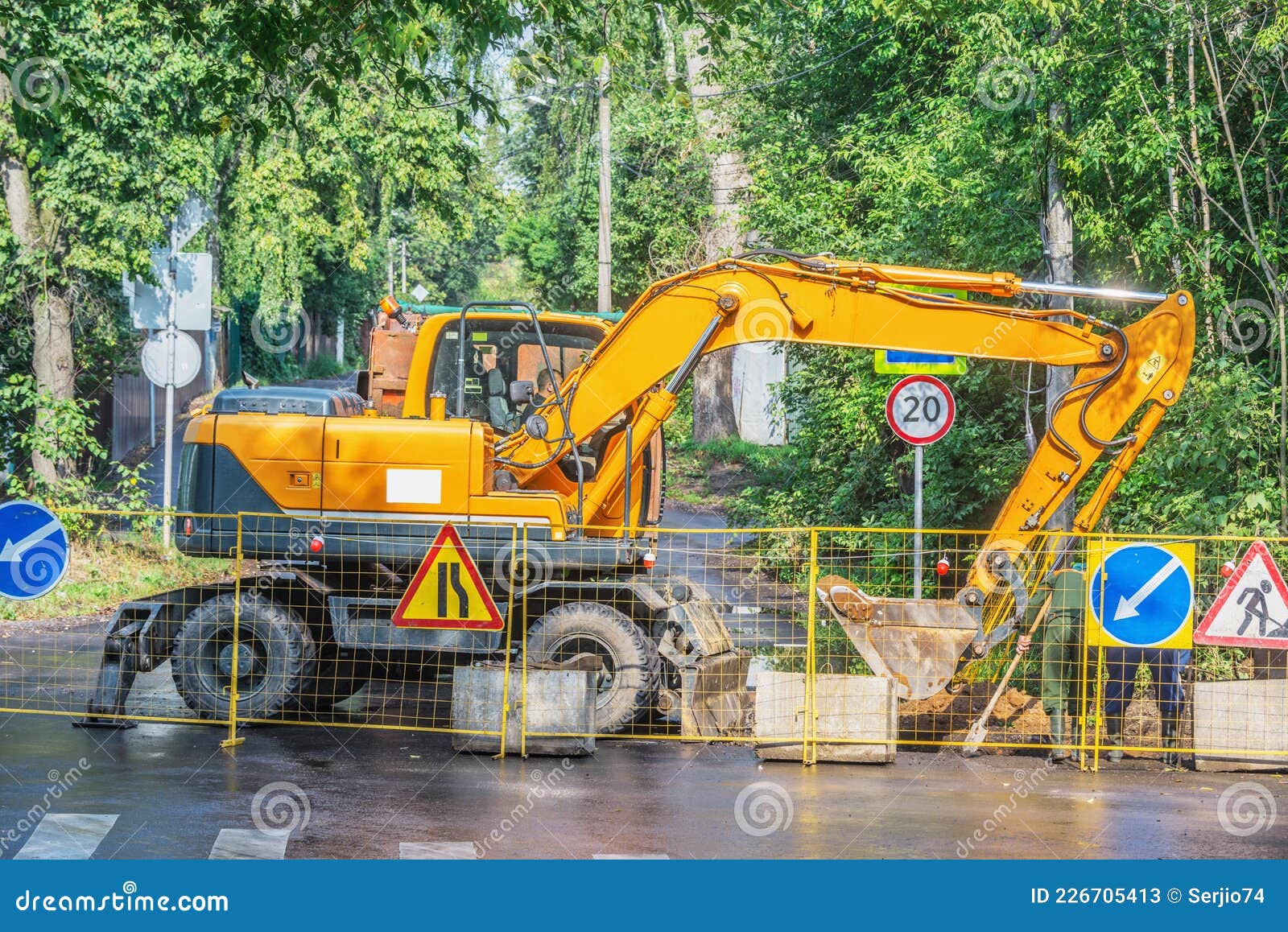 Excavator Digs a Hole on the Construction Site. Editorial Stock Photo ...