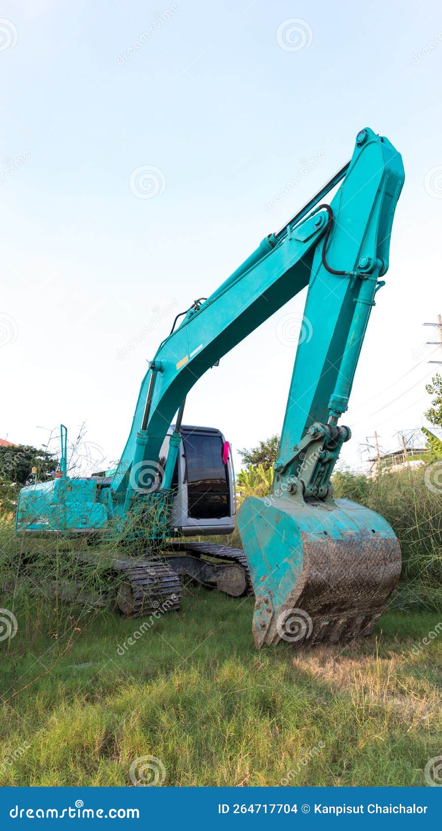 The Excavator Digs a Soil. Digger Loading Trucks with Soil. Excavator ...