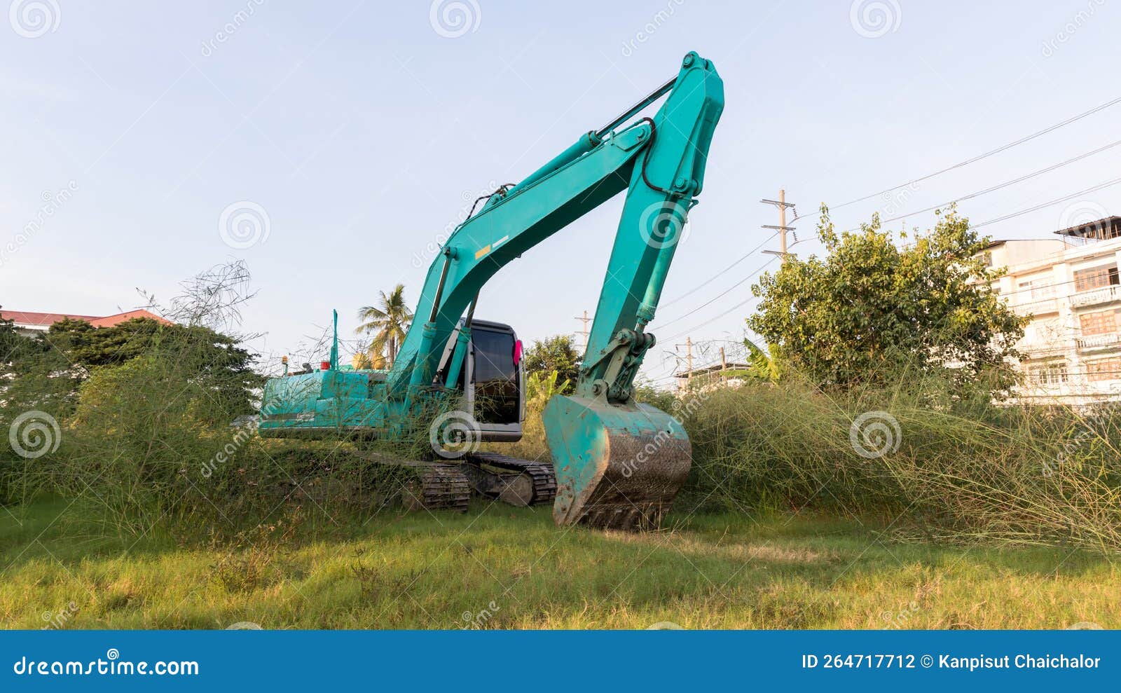 The Excavator Digs a Soil. Digger Loading Trucks with Soil. Excavator ...