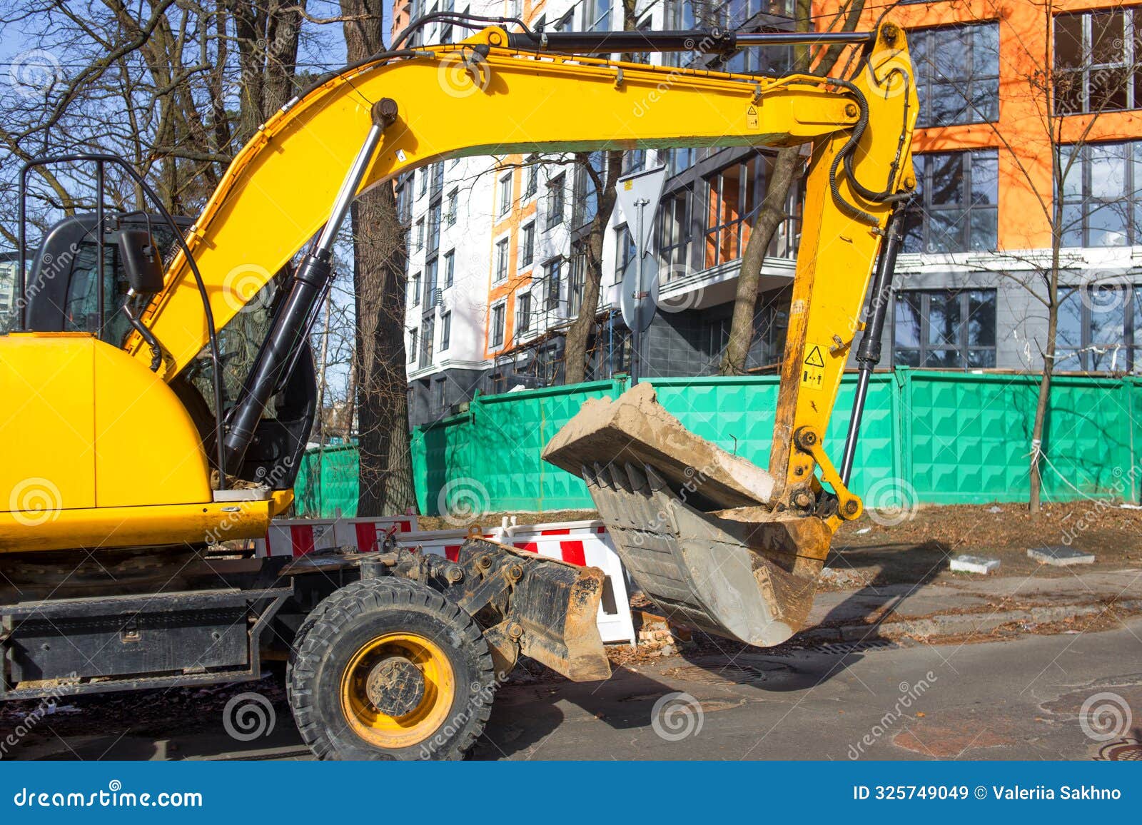 Excavator Doing Construction Work on a Section of Road Stock Image ...
